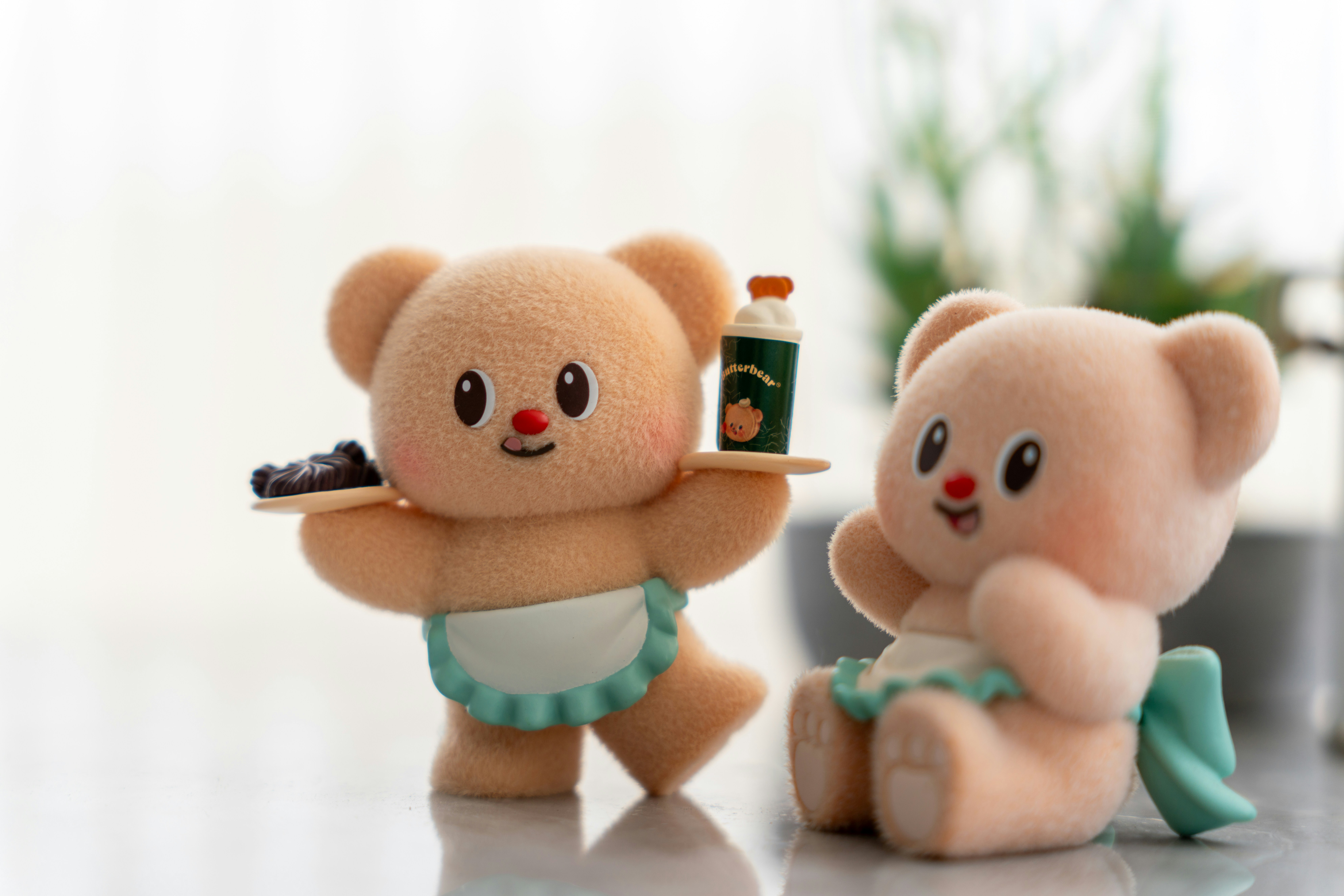 Two Plush Bear Friends Share a Tiny Snack Moment