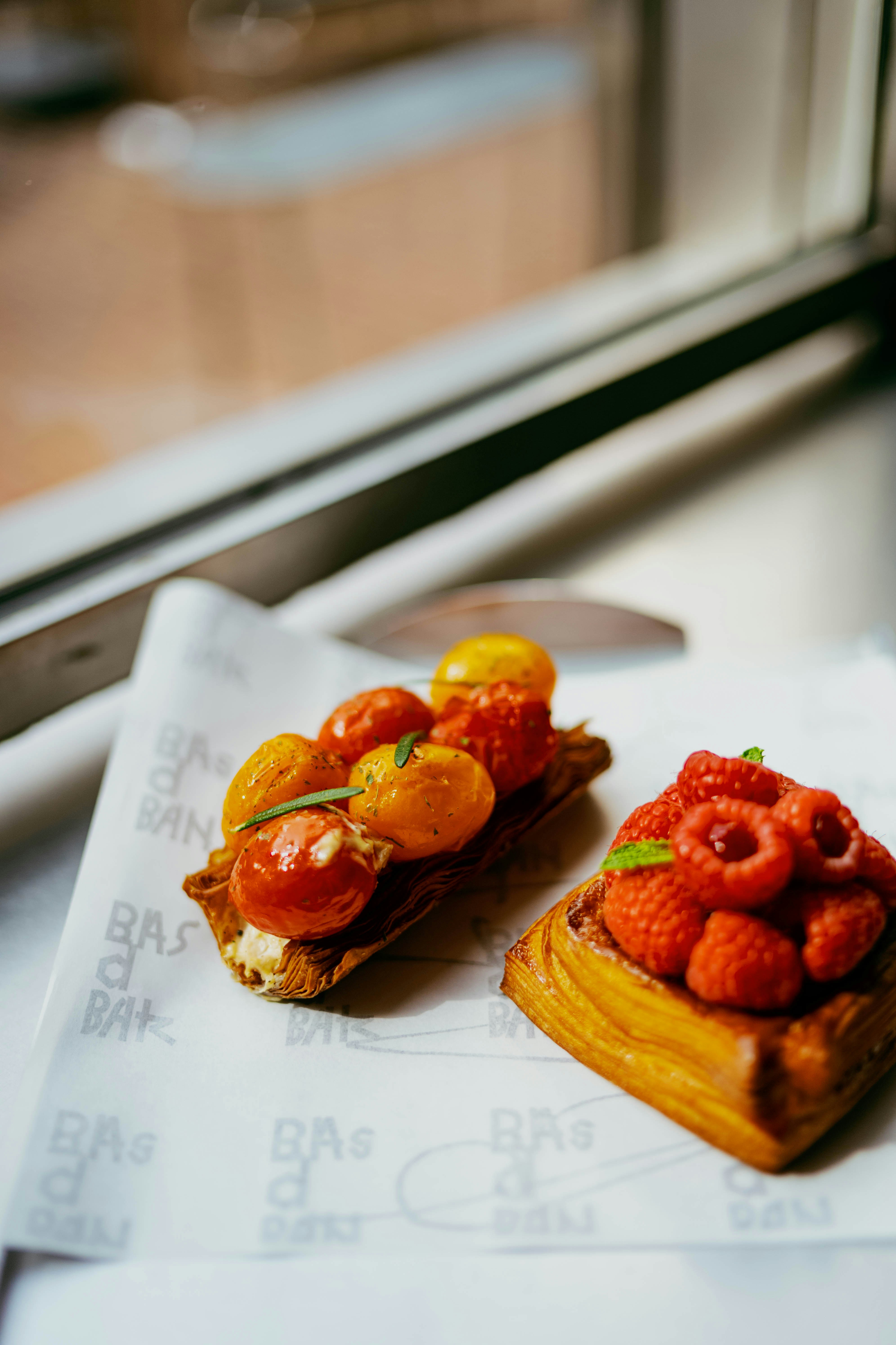 Delicious pastries topped with tomatoes and berries. photo – Free Food ...
