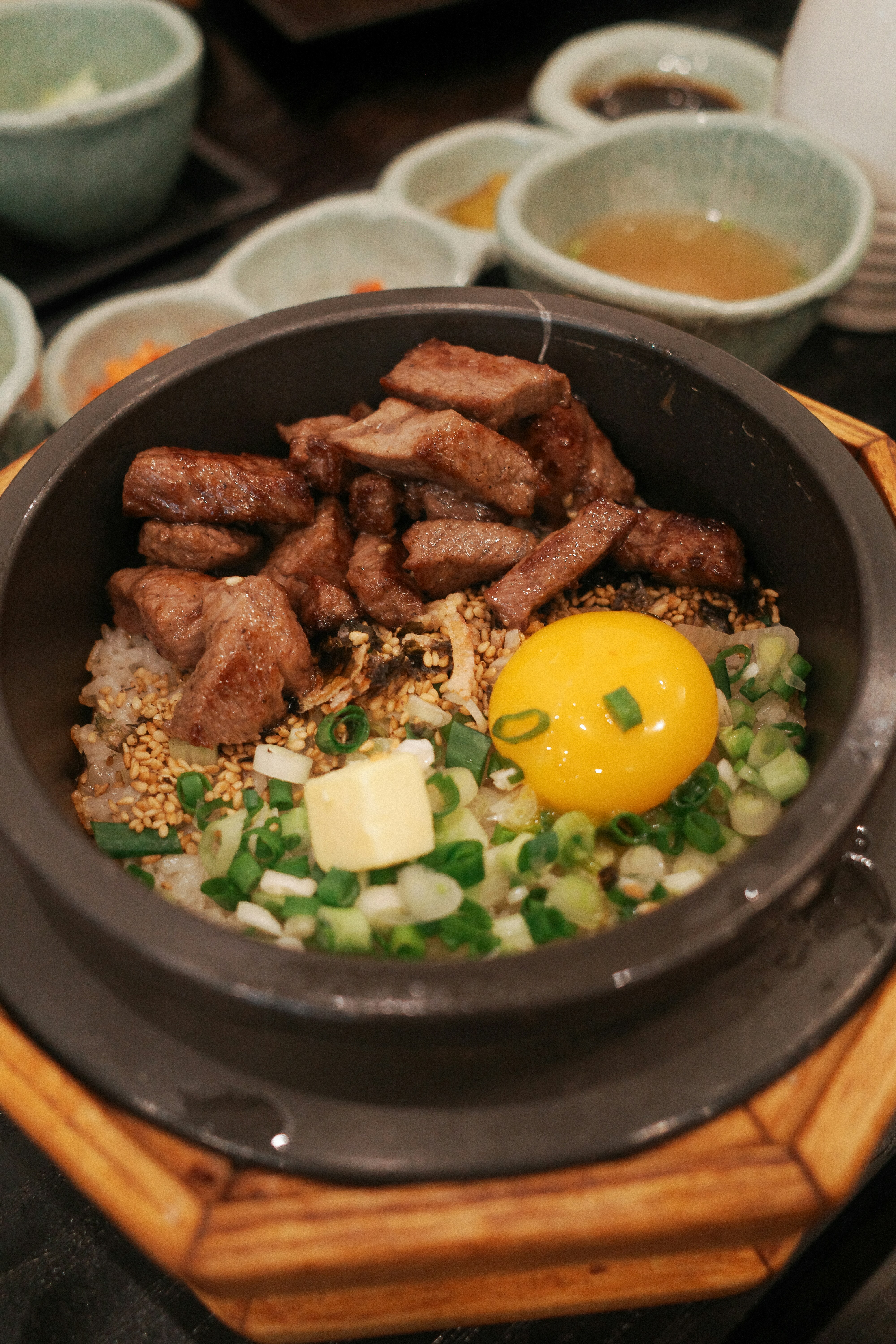 Sizzling Harmony: A Culinary Delight in a Stone Bowl