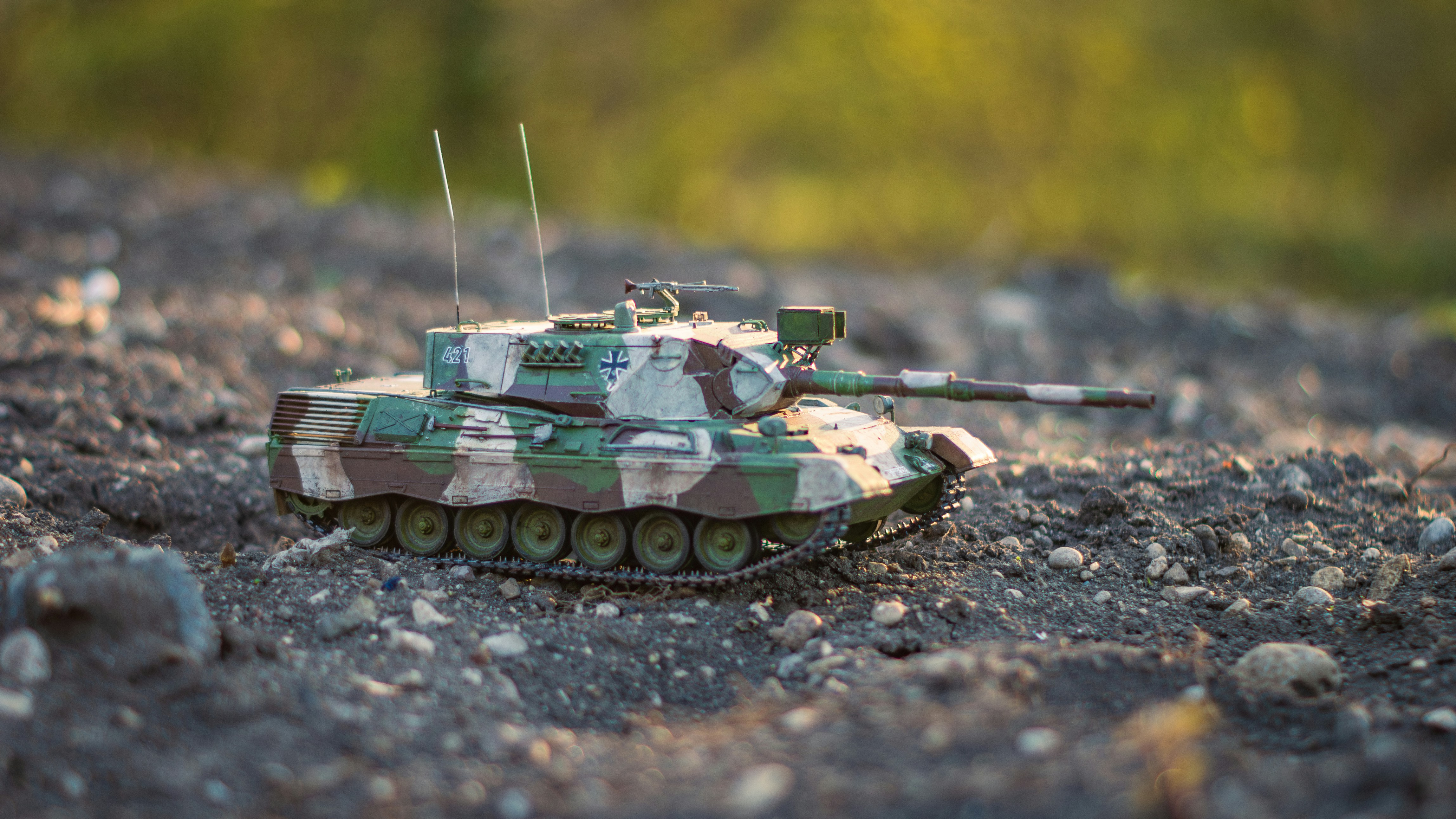 Camouflaged Miniature Tank Stalks the Pebble Field