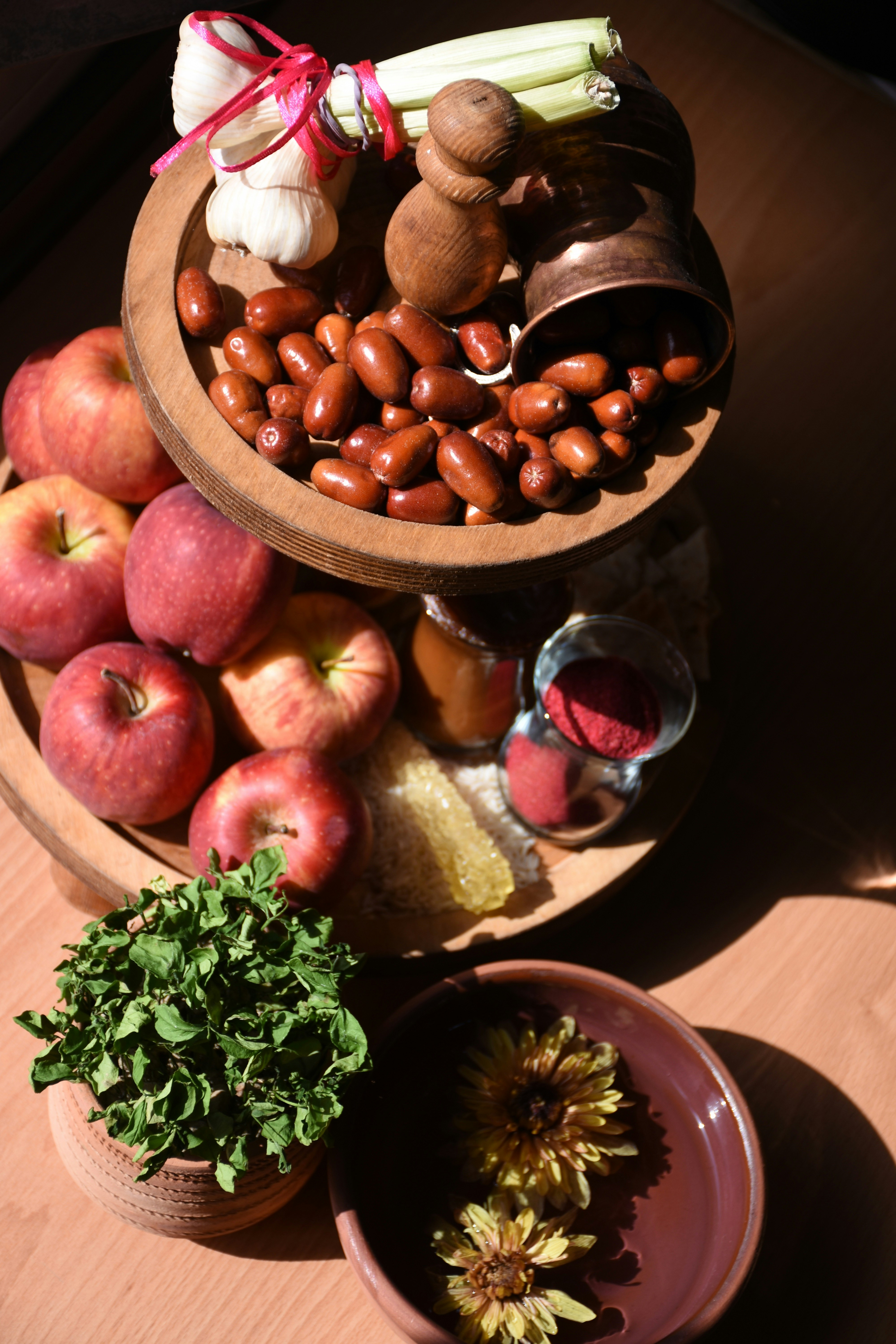 Harvest of Warm Hues: Nuts, Apples, and Herbs in a Rustic Still Life
