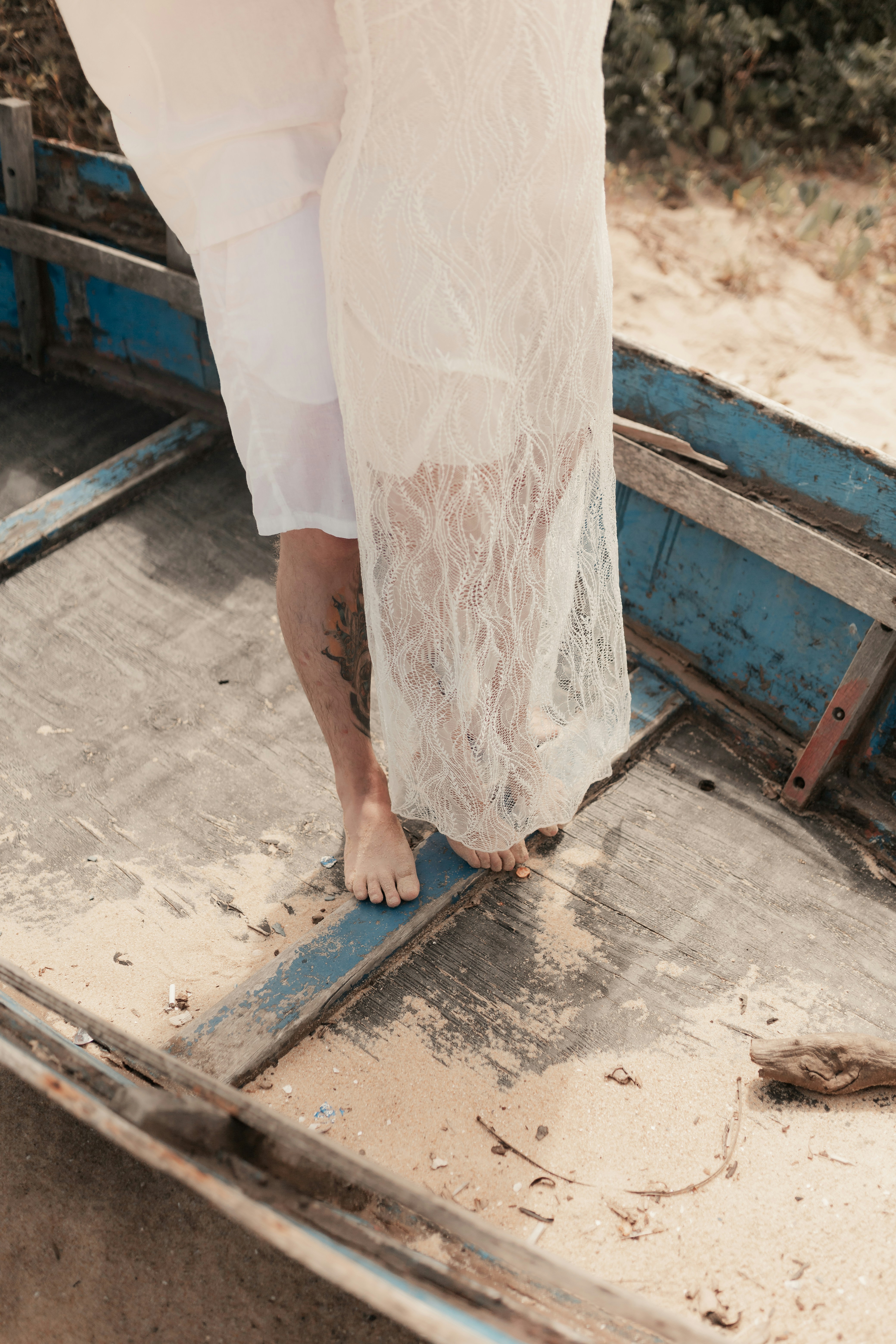 Barefeet in Lace on a Weathered Boat Deck