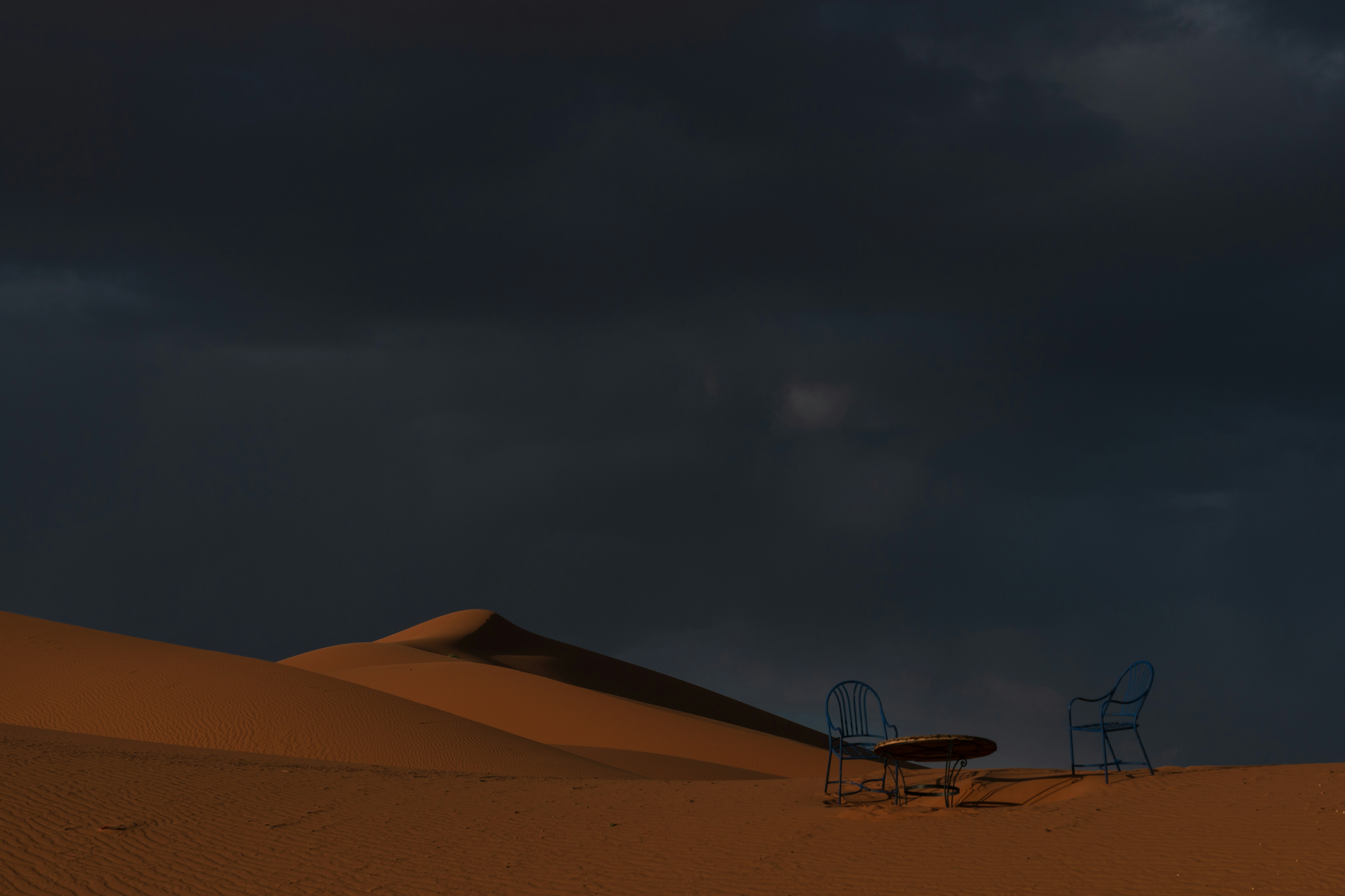 Moonlit Dune Rendezvous: A Minimalist Desert Seating Scene