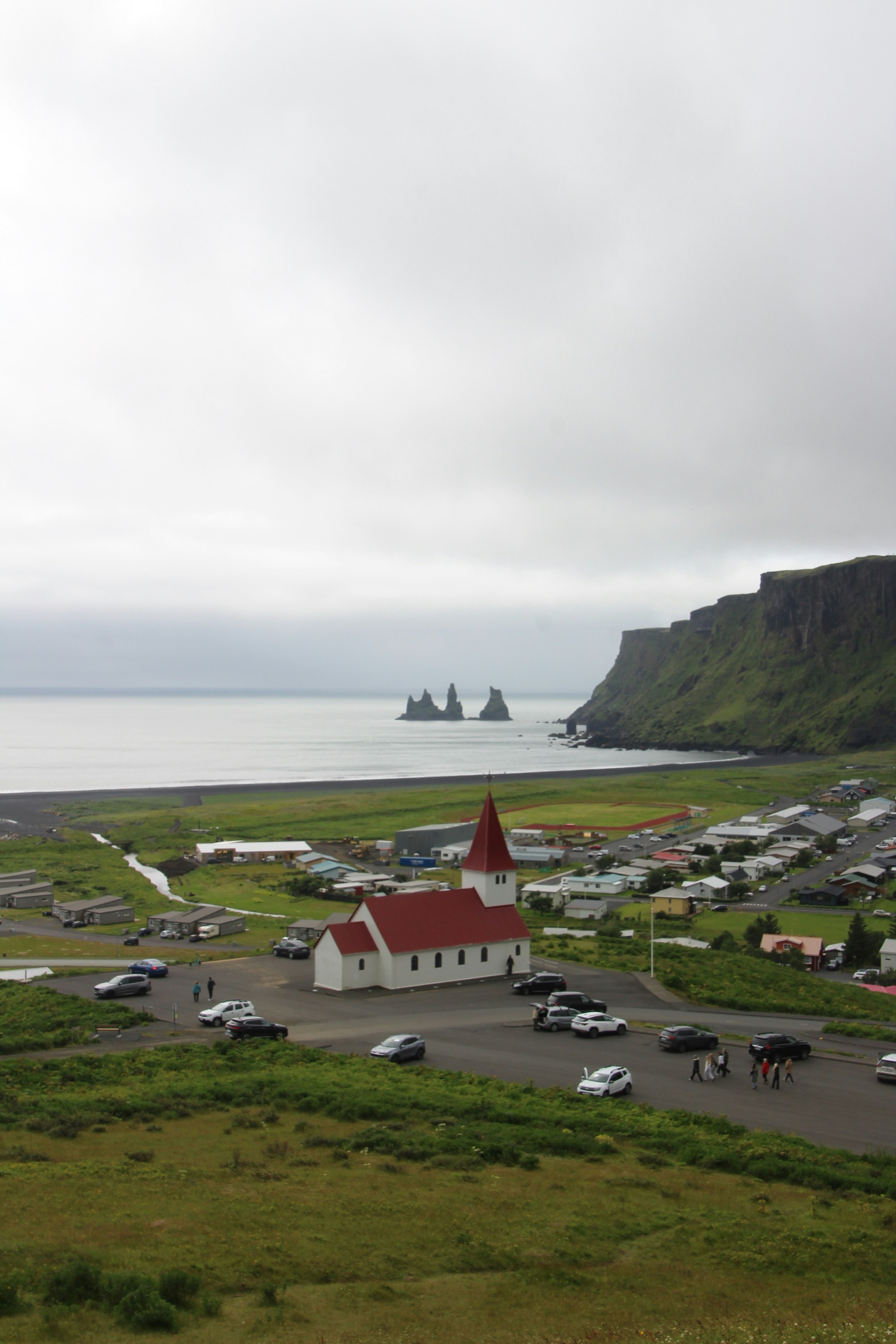 Crimson-roofed chapel anchors a windswept coastal village