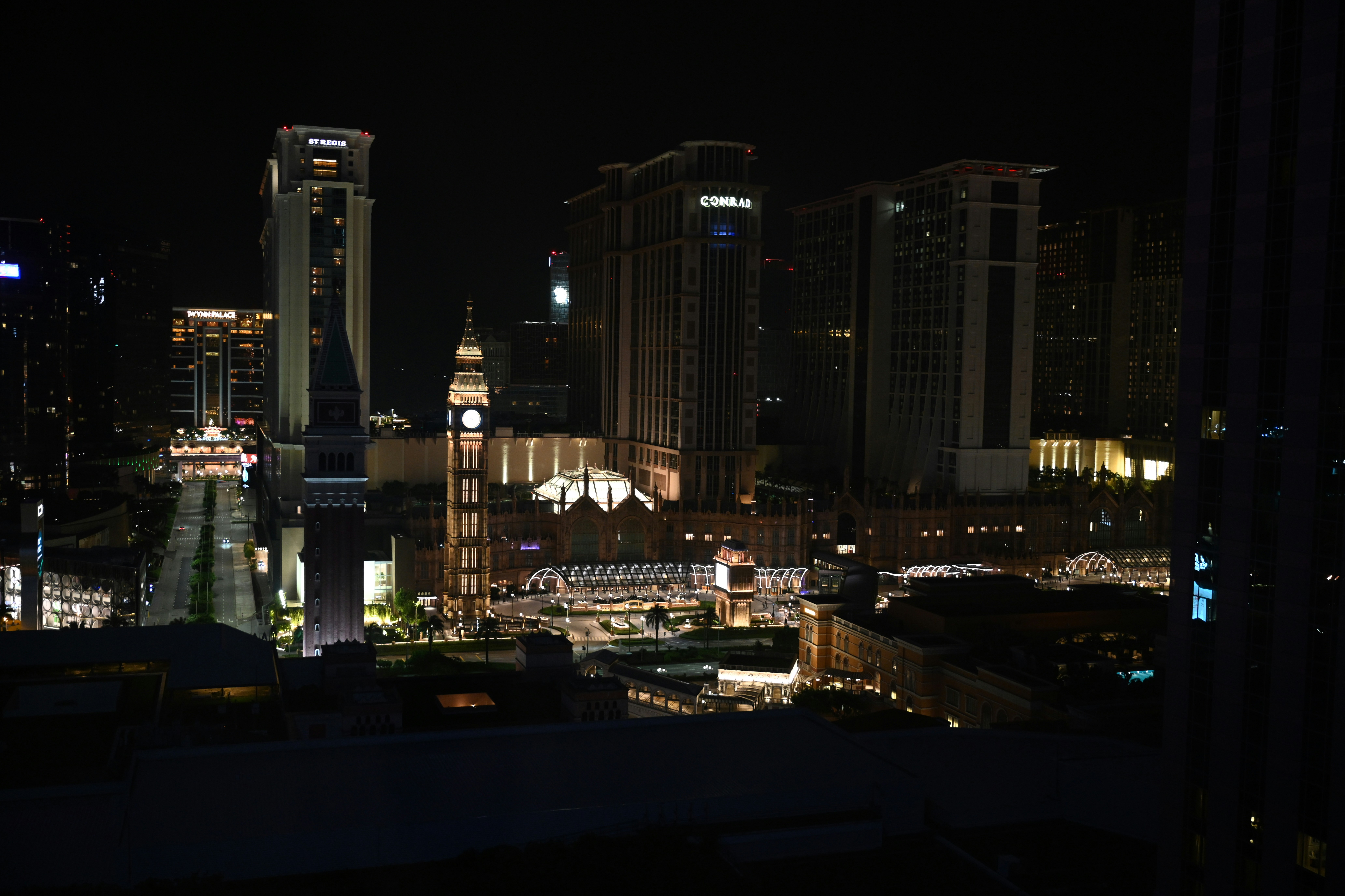 Nighttime view of a city skyline with illuminated buildings. photo ...