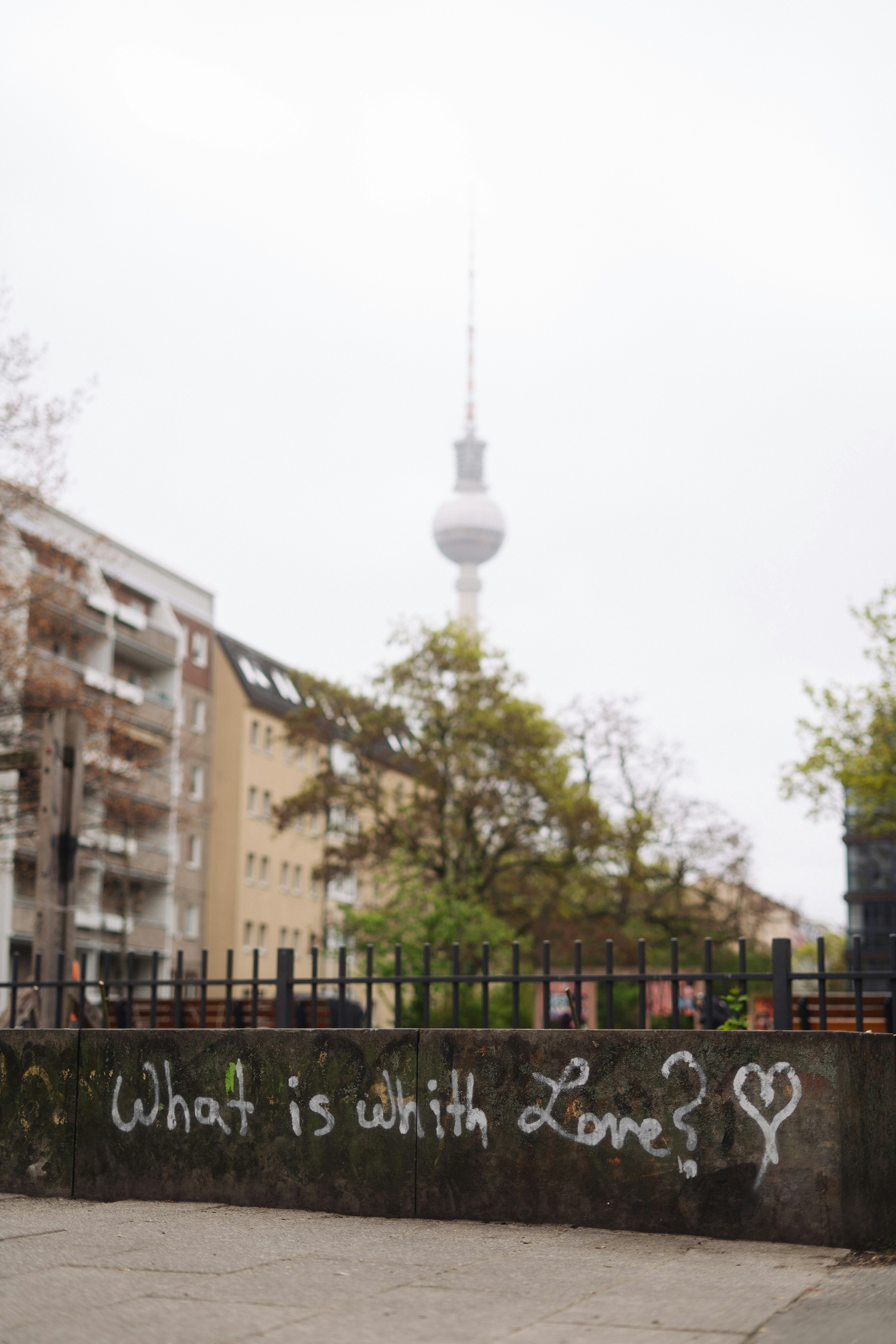 Love on the Wall, Berlin’s Fernsehturm Rising Through the Haze