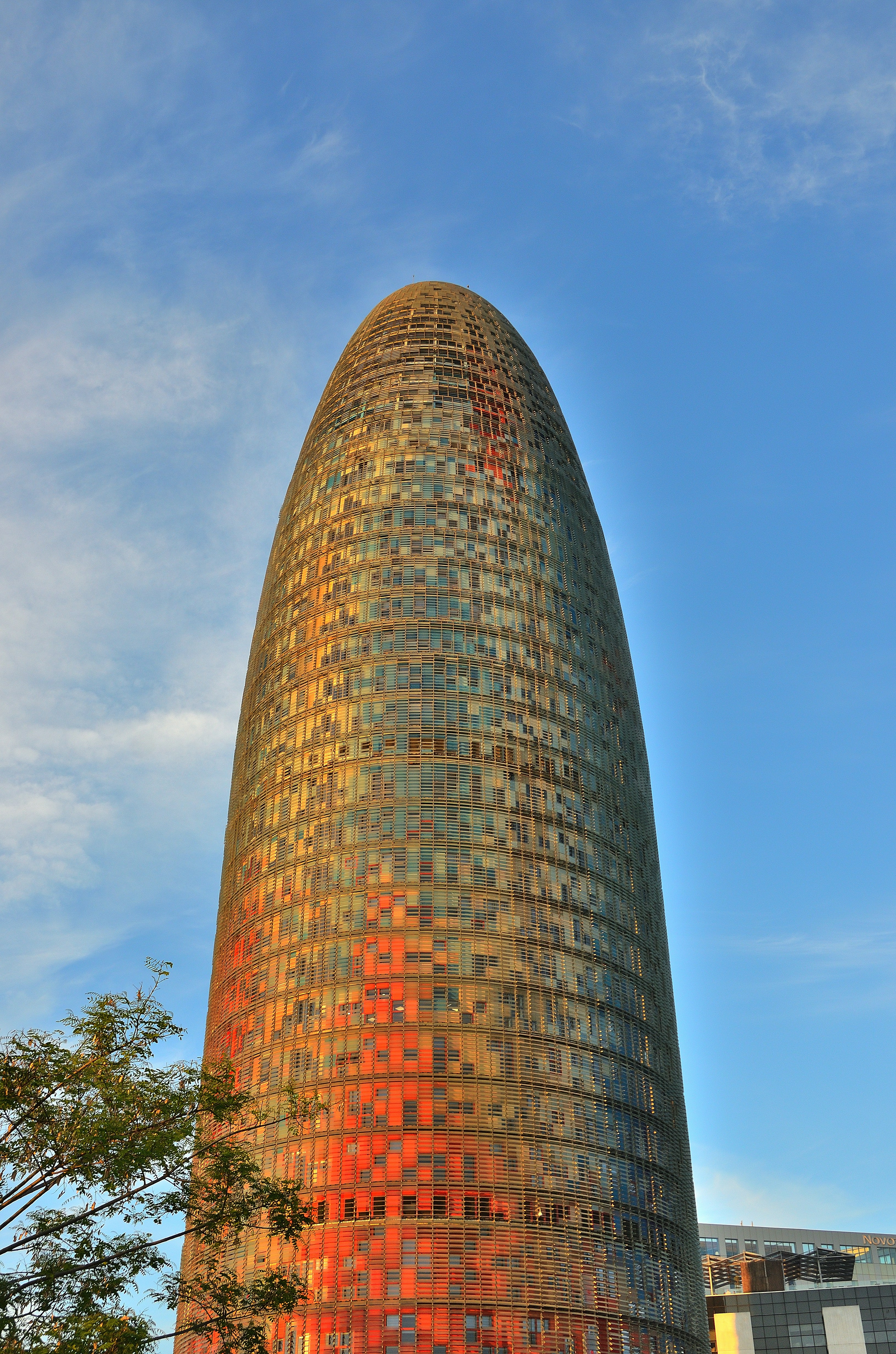Glazed Apex: Torre Glòries Shimmers in Barcelona’s Sunset