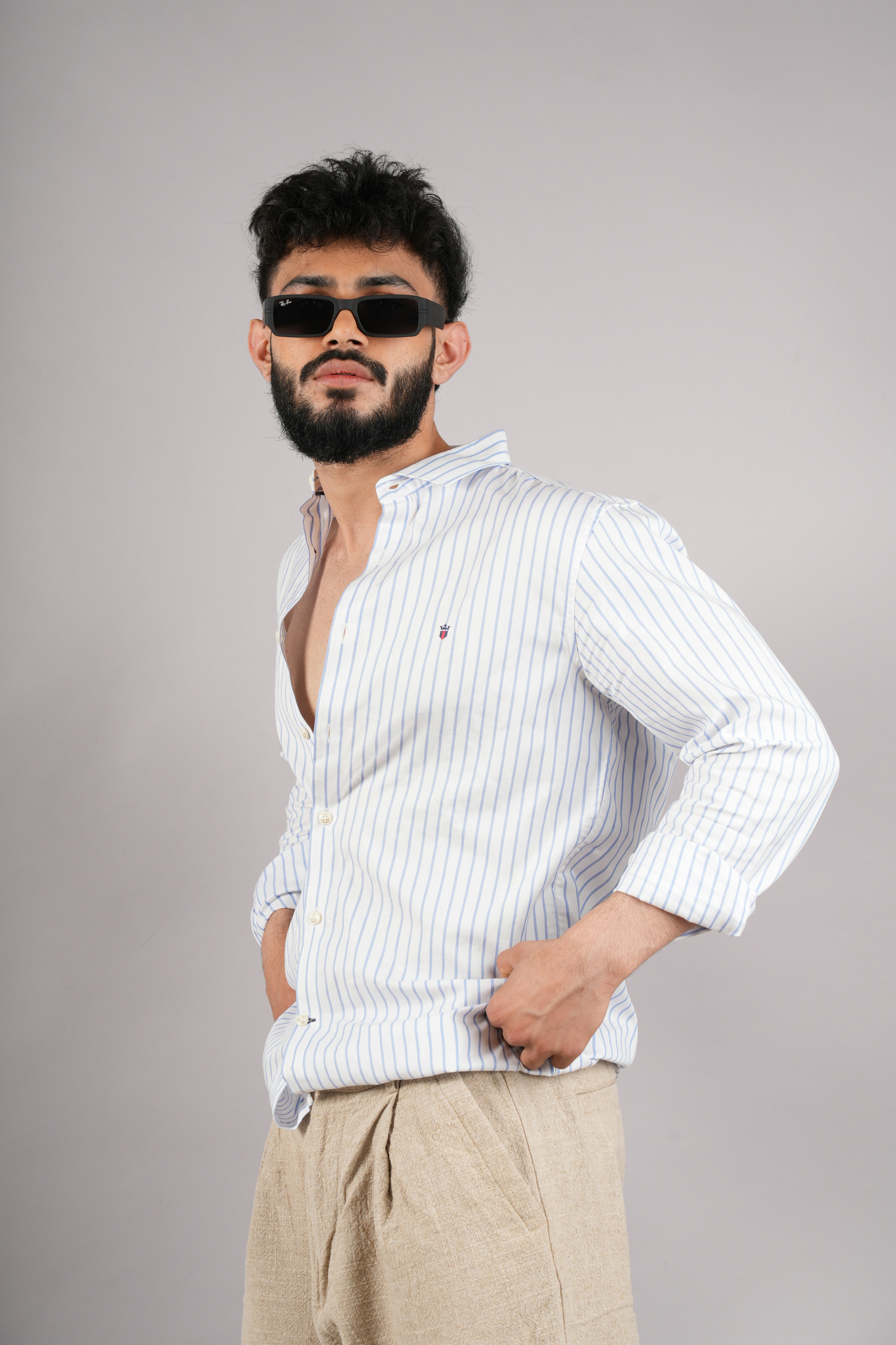 Confidence in Cotton Stripes: A Studio Portrait