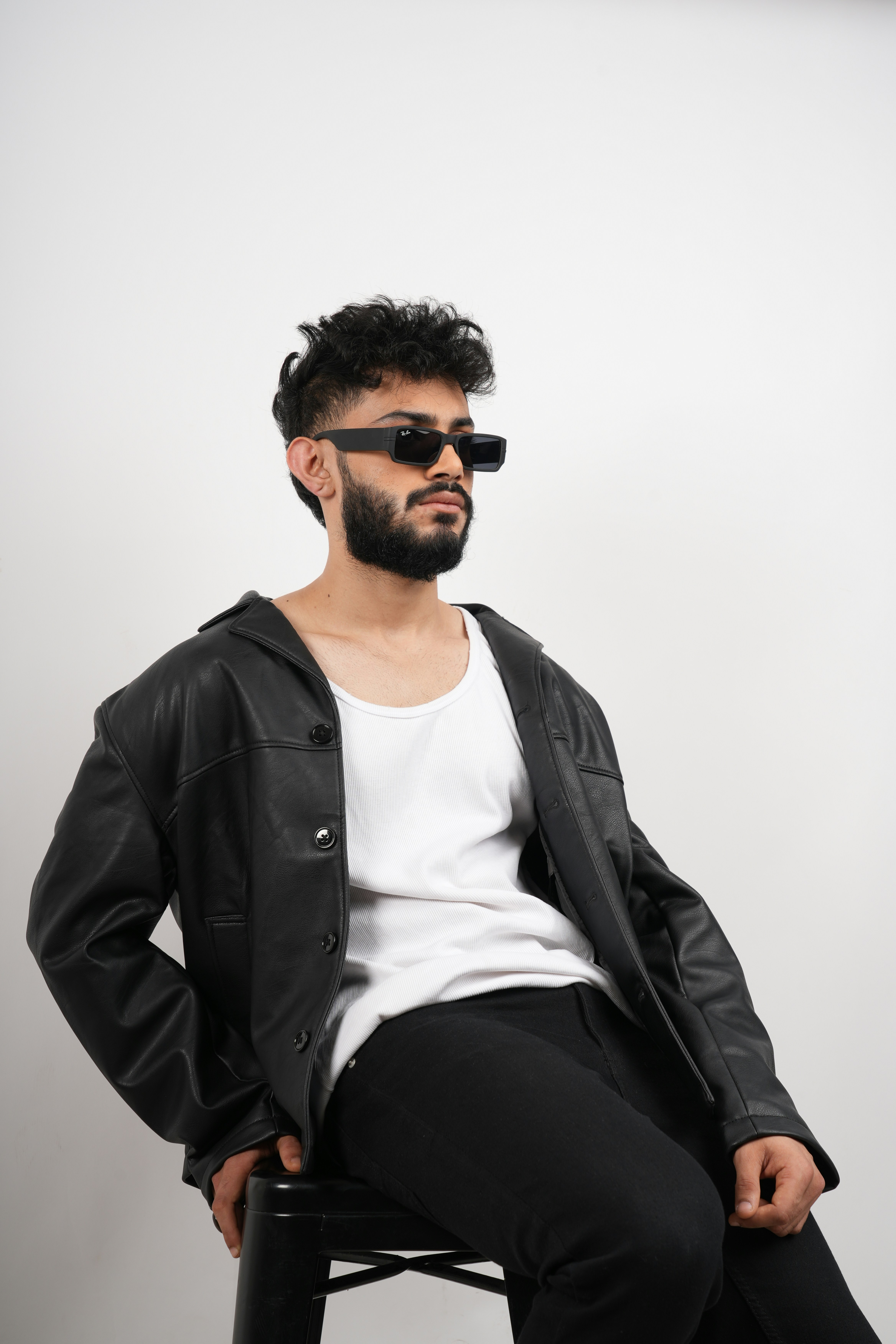 A man models in a leather jacket and sunglasses. photo – Free Portrait ...