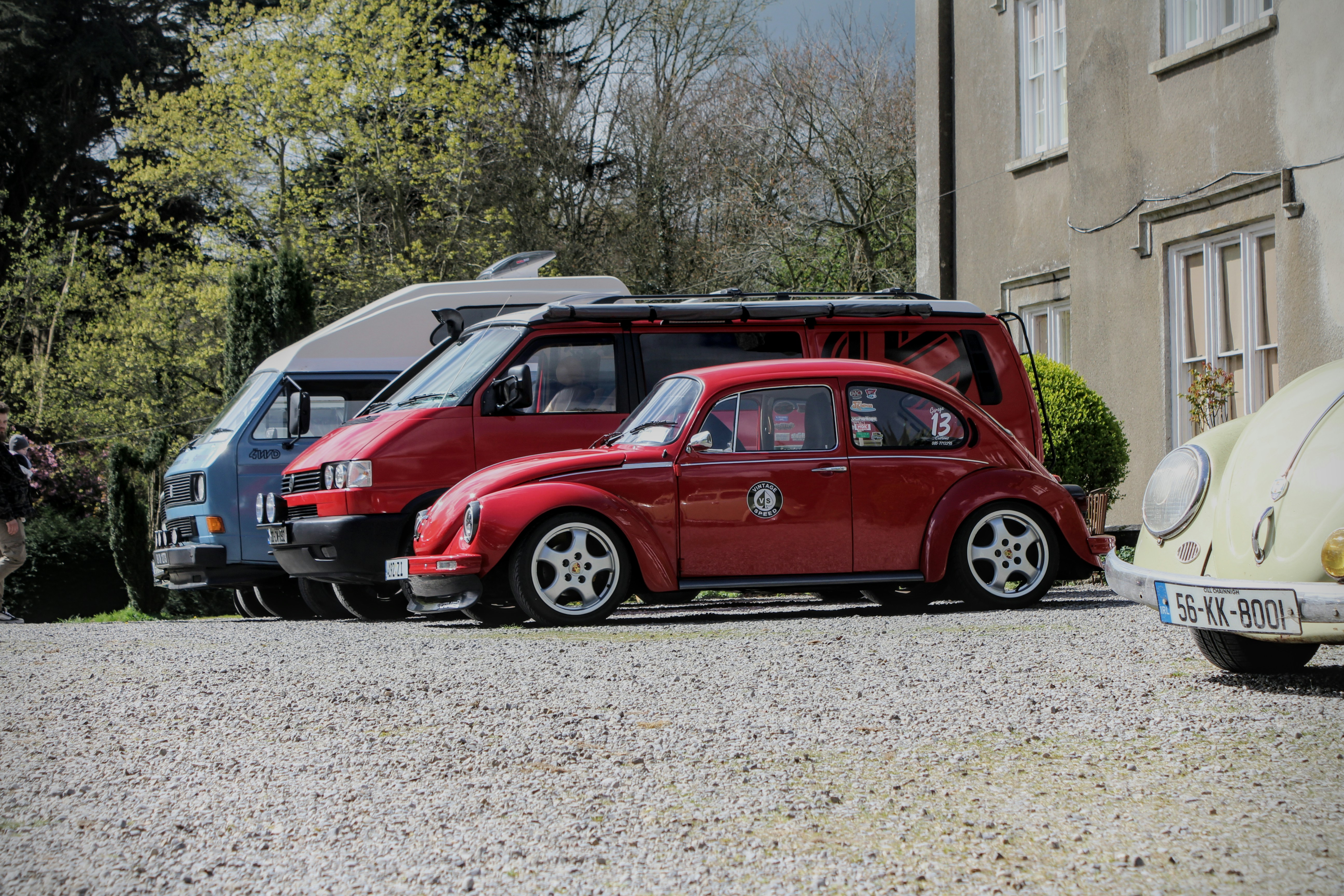 Classic cars are parked in a gravel driveway. photo – Free Car Image on ...