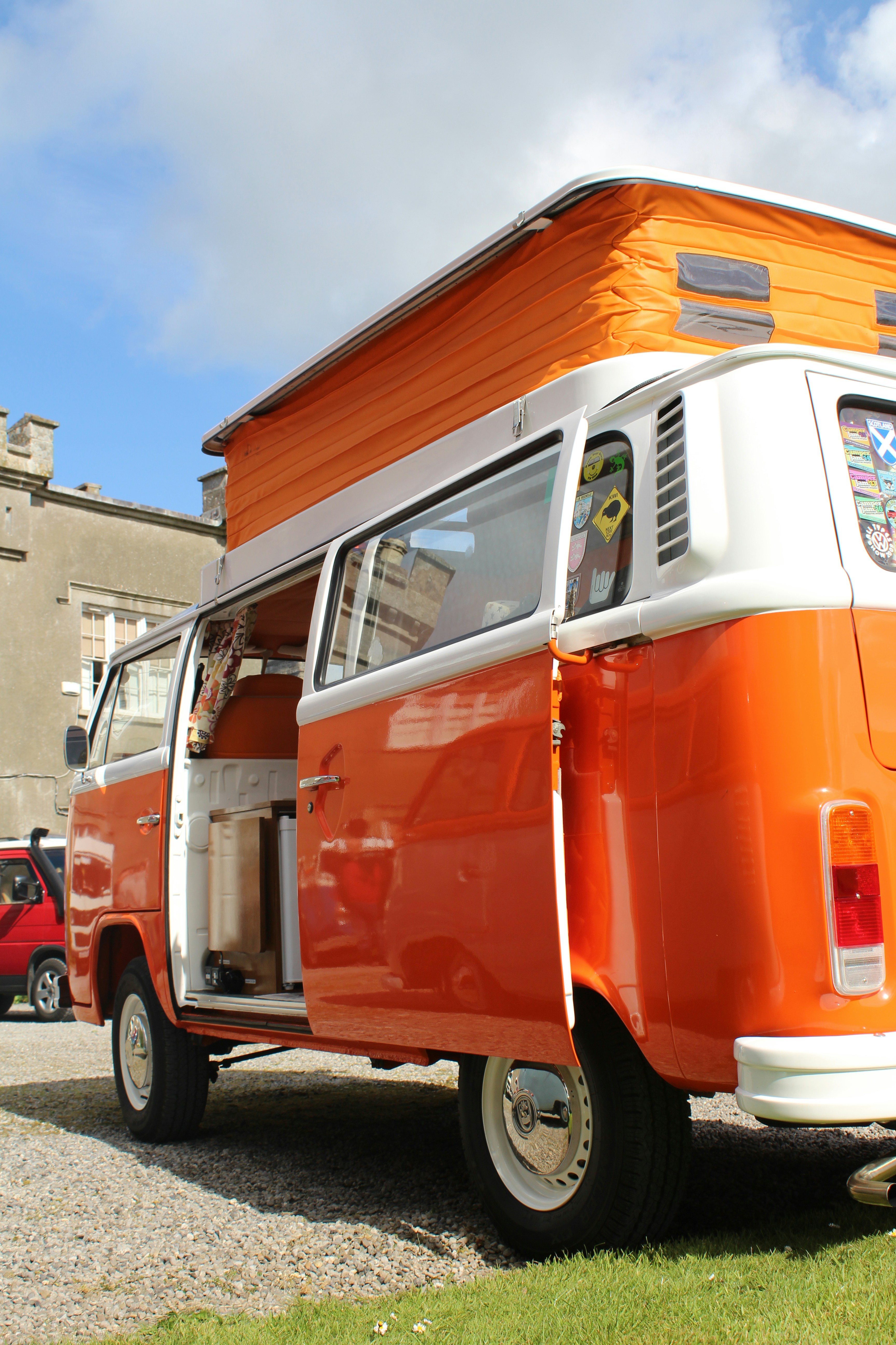 Sunlit Retro Camper Van: An Open Door to Roaming Roads