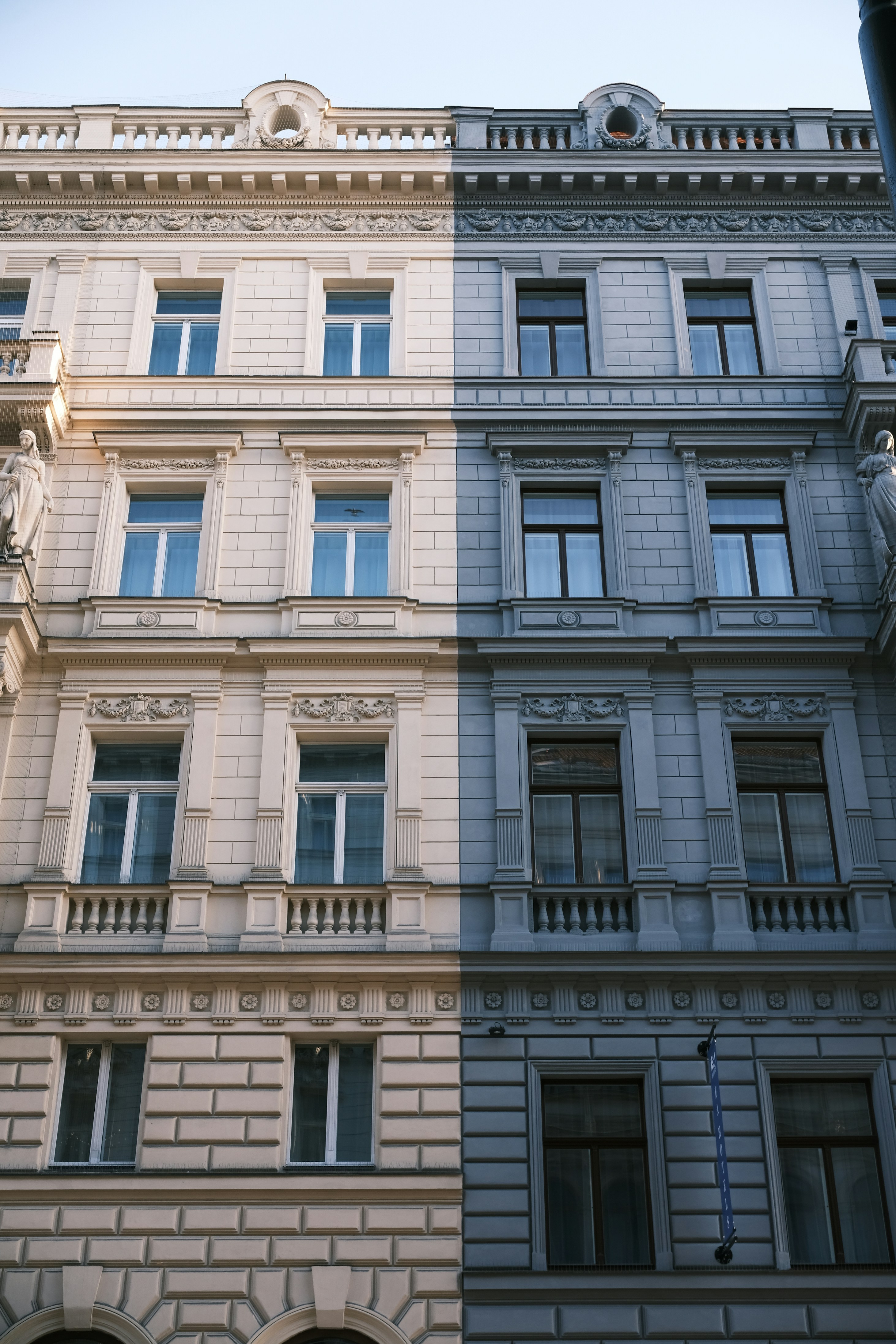 A building split by light and shadow. photo – Free Building Image on ...