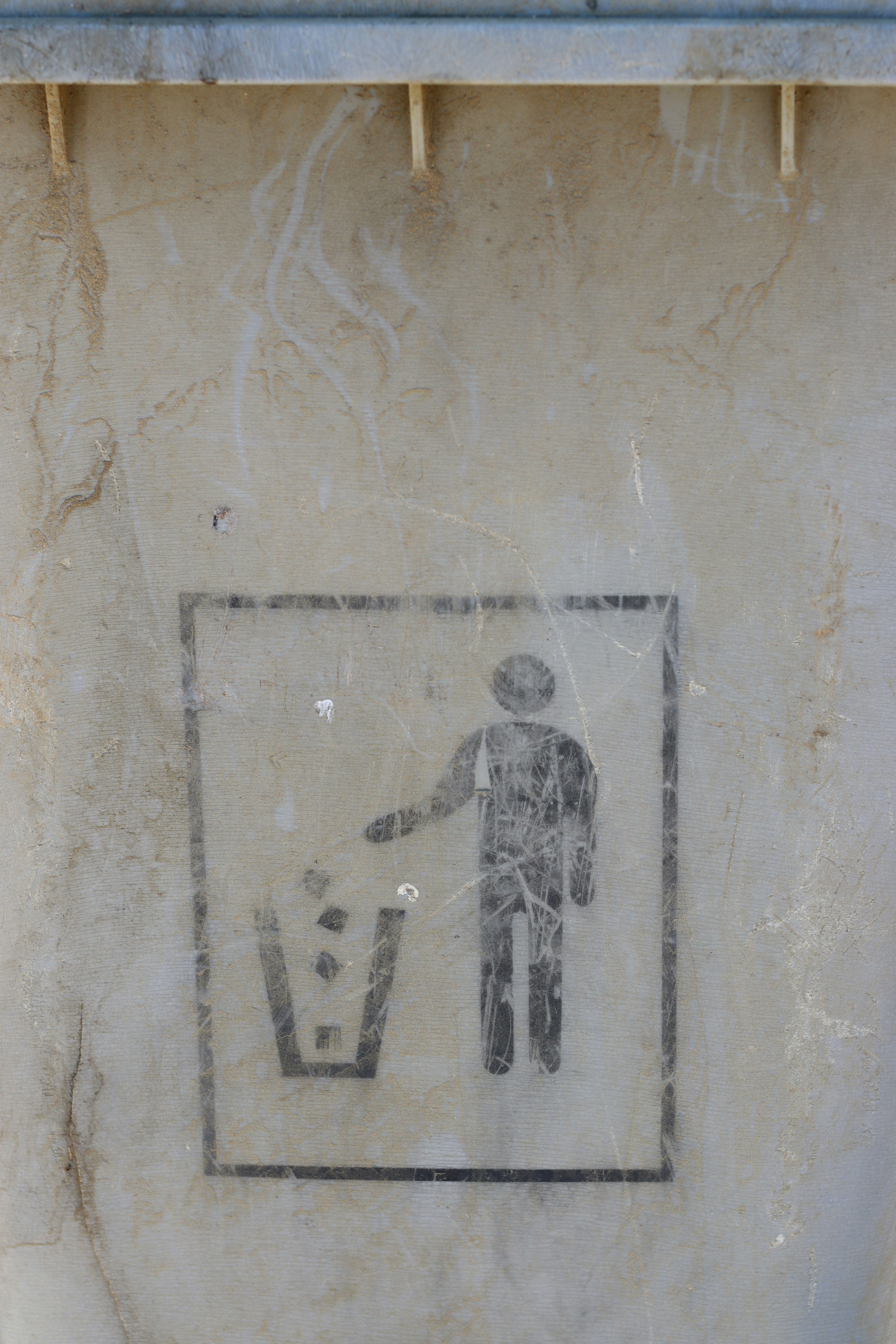 Symbolic illustration promoting proper waste disposal with a figure placing items into a trash bin.
