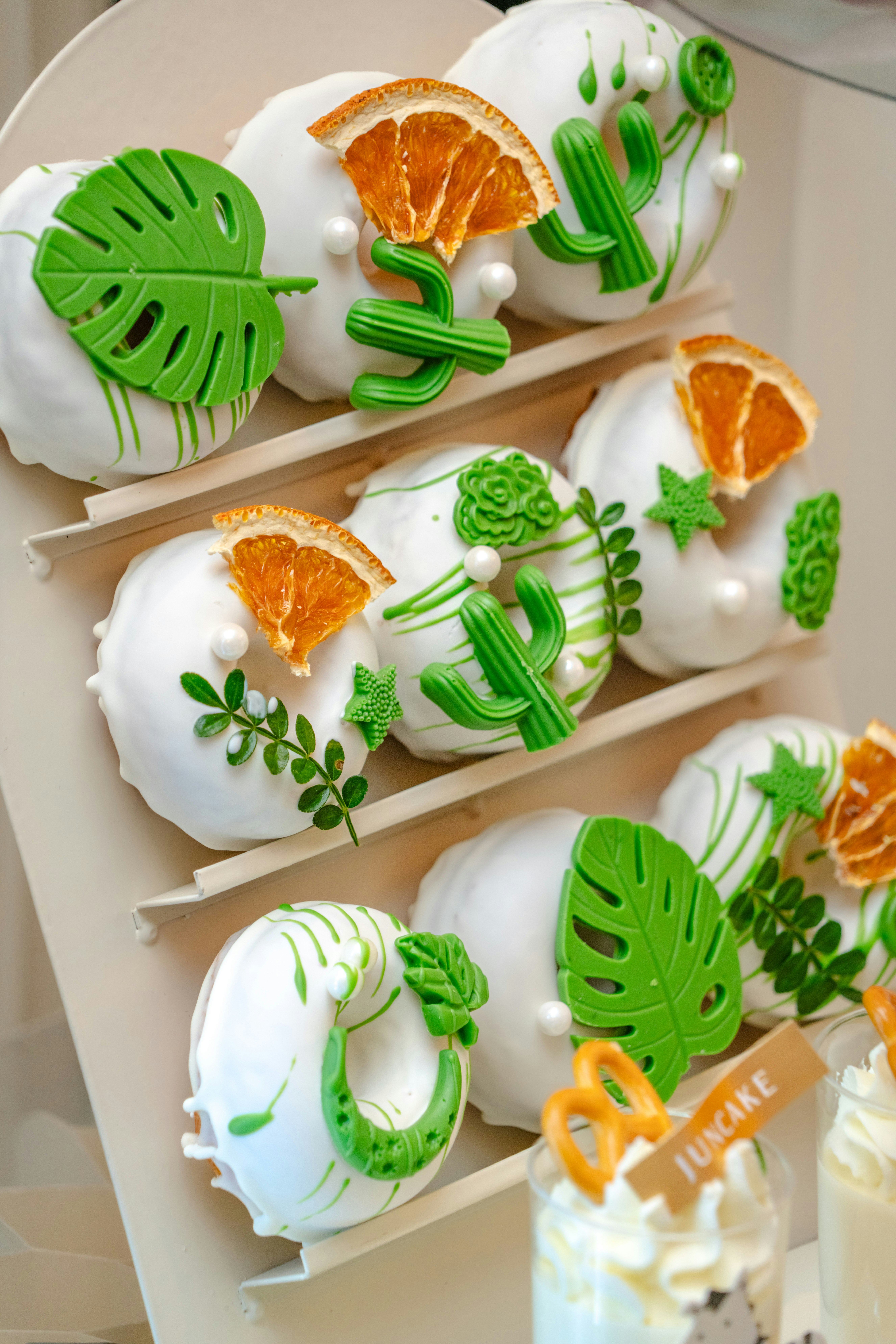 Verdant Delights: Green-Decorated Donuts Ascend a Wooden Staircase