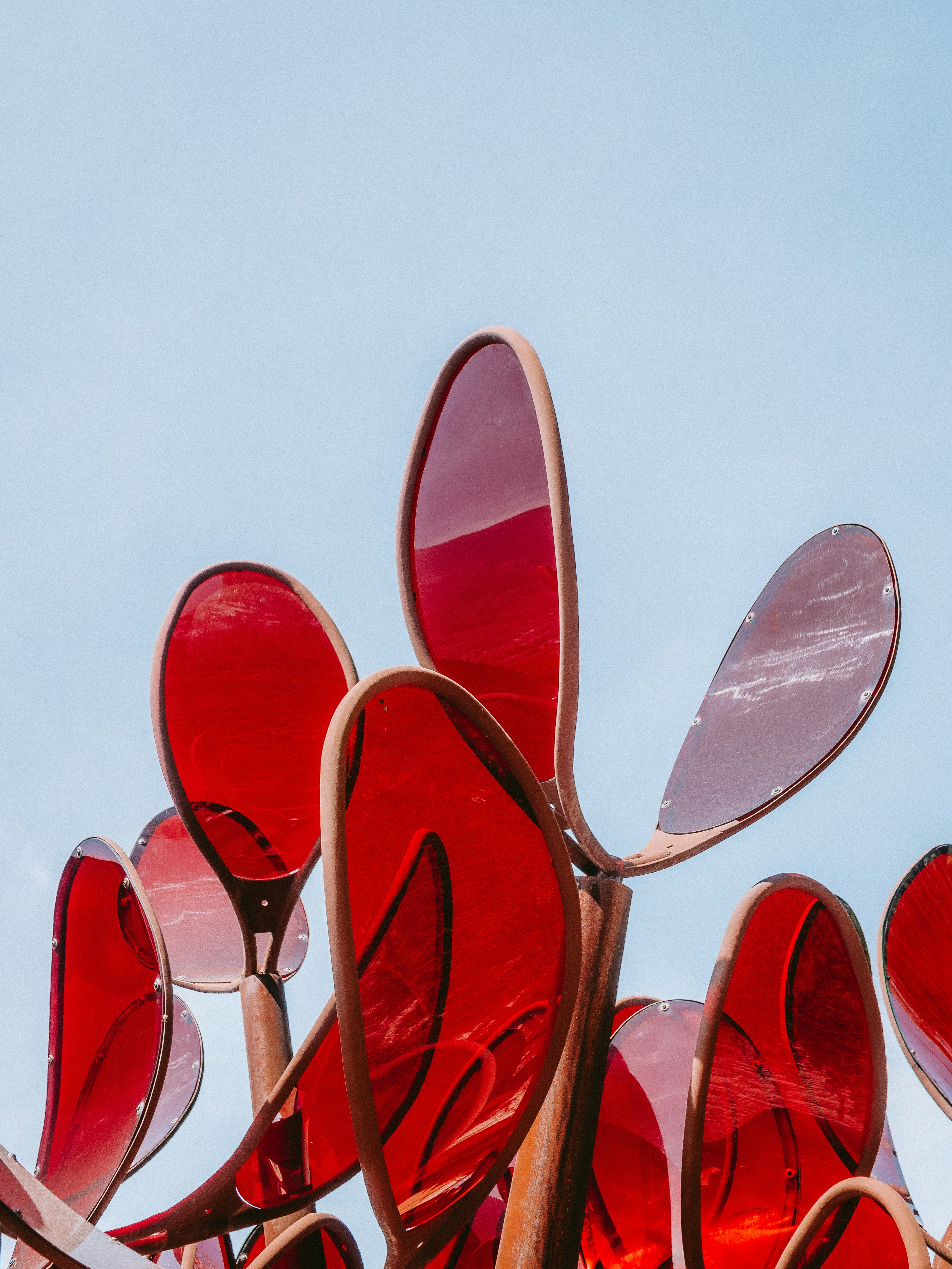 Red Orbitals Under a Blue Sky: A Kinetic Sculpture of Reflections