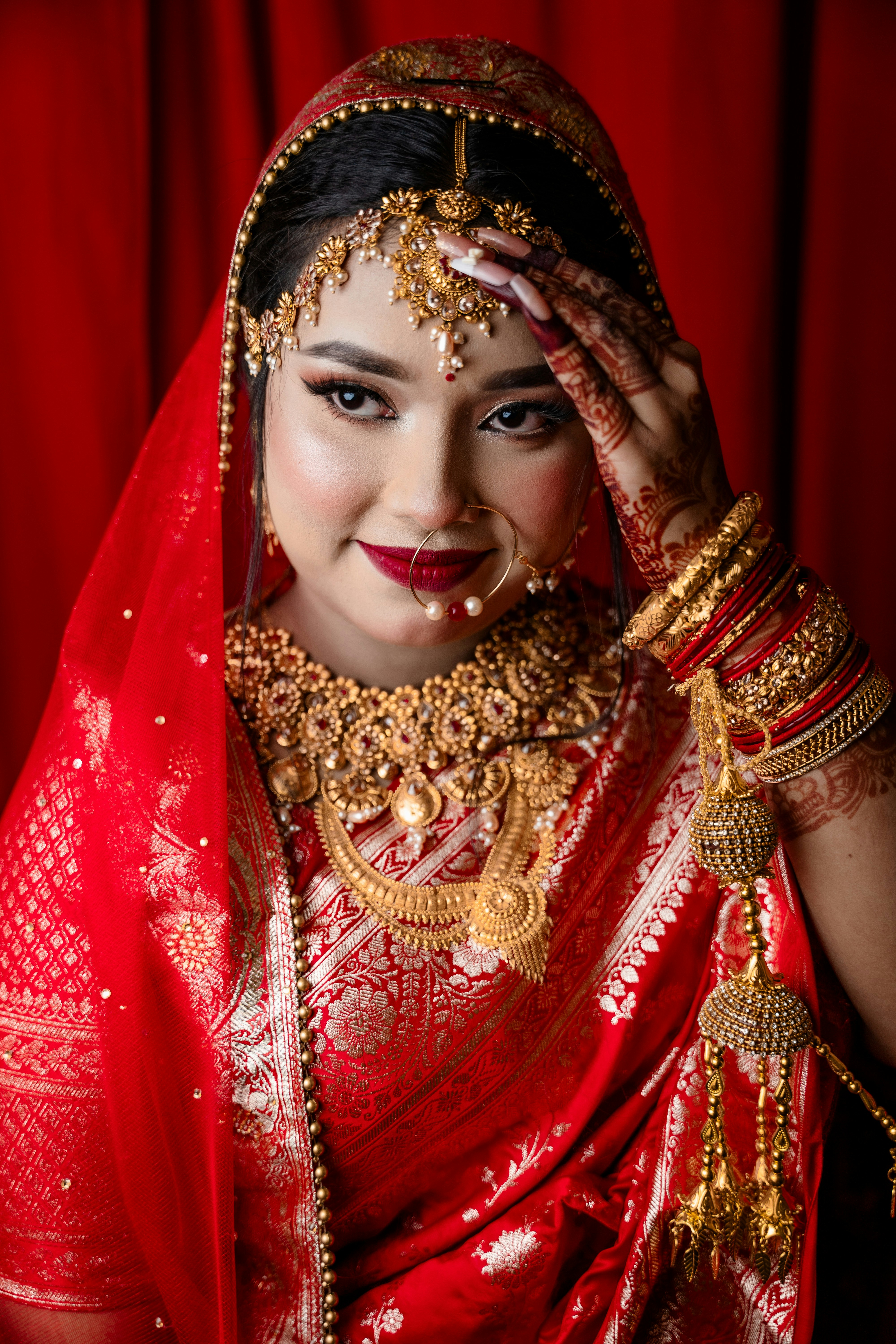 A beautiful bride in traditional red wedding attire. photo – Free ...