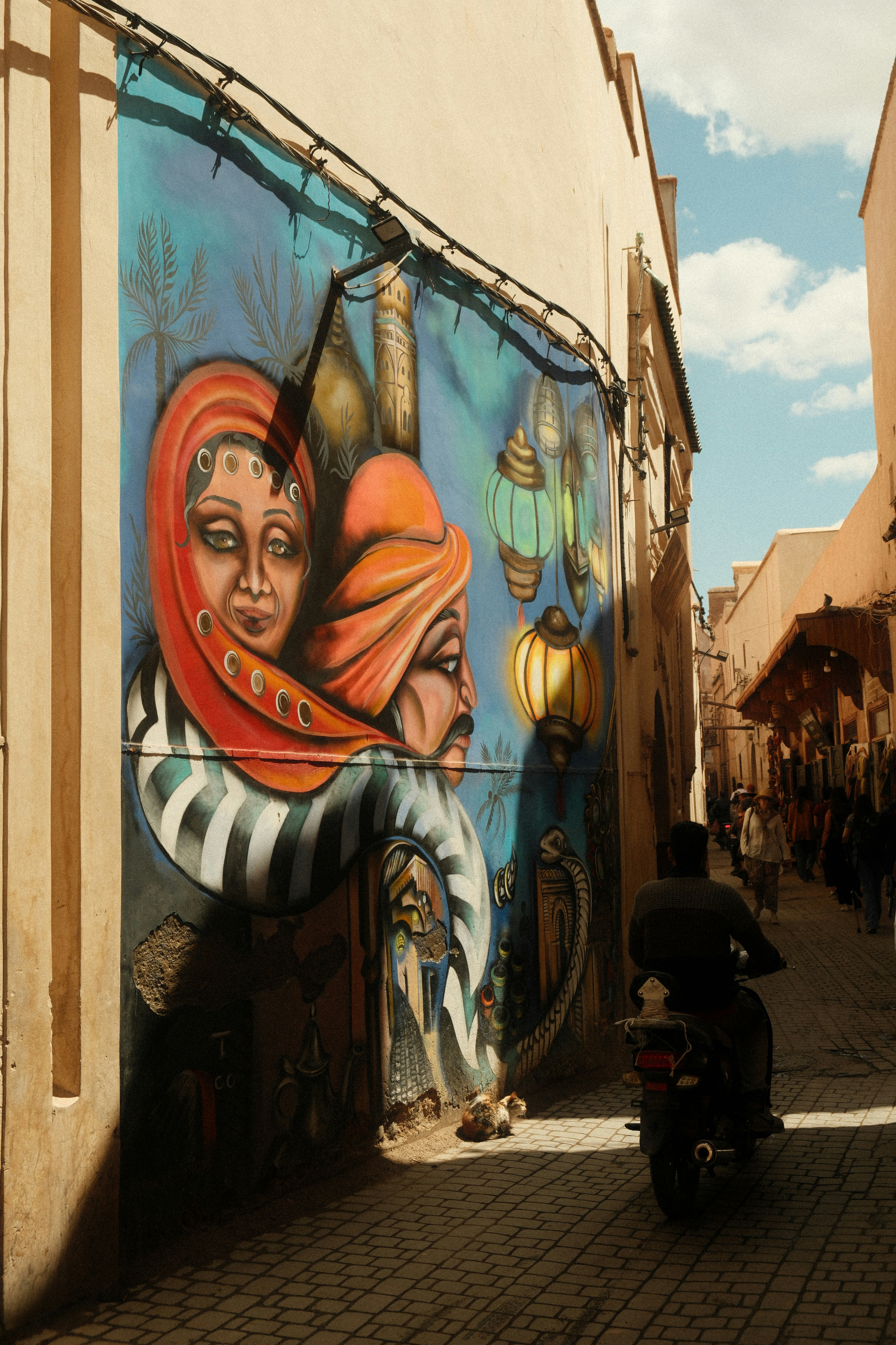 Moroccan street scene featuring vibrant mural art. photo – Free Woman ...