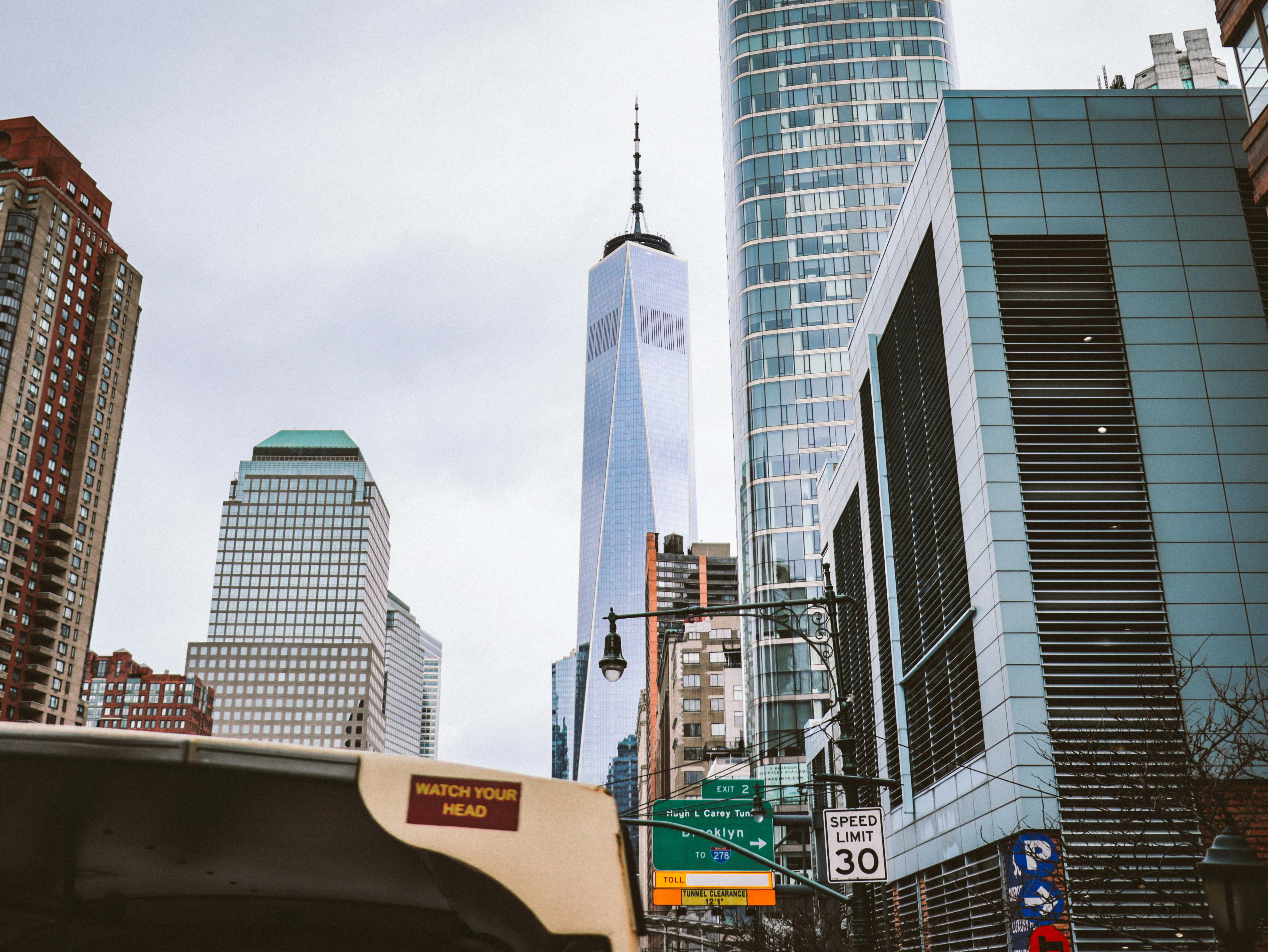 The image shows buildings in a city, including the one world trade ...
