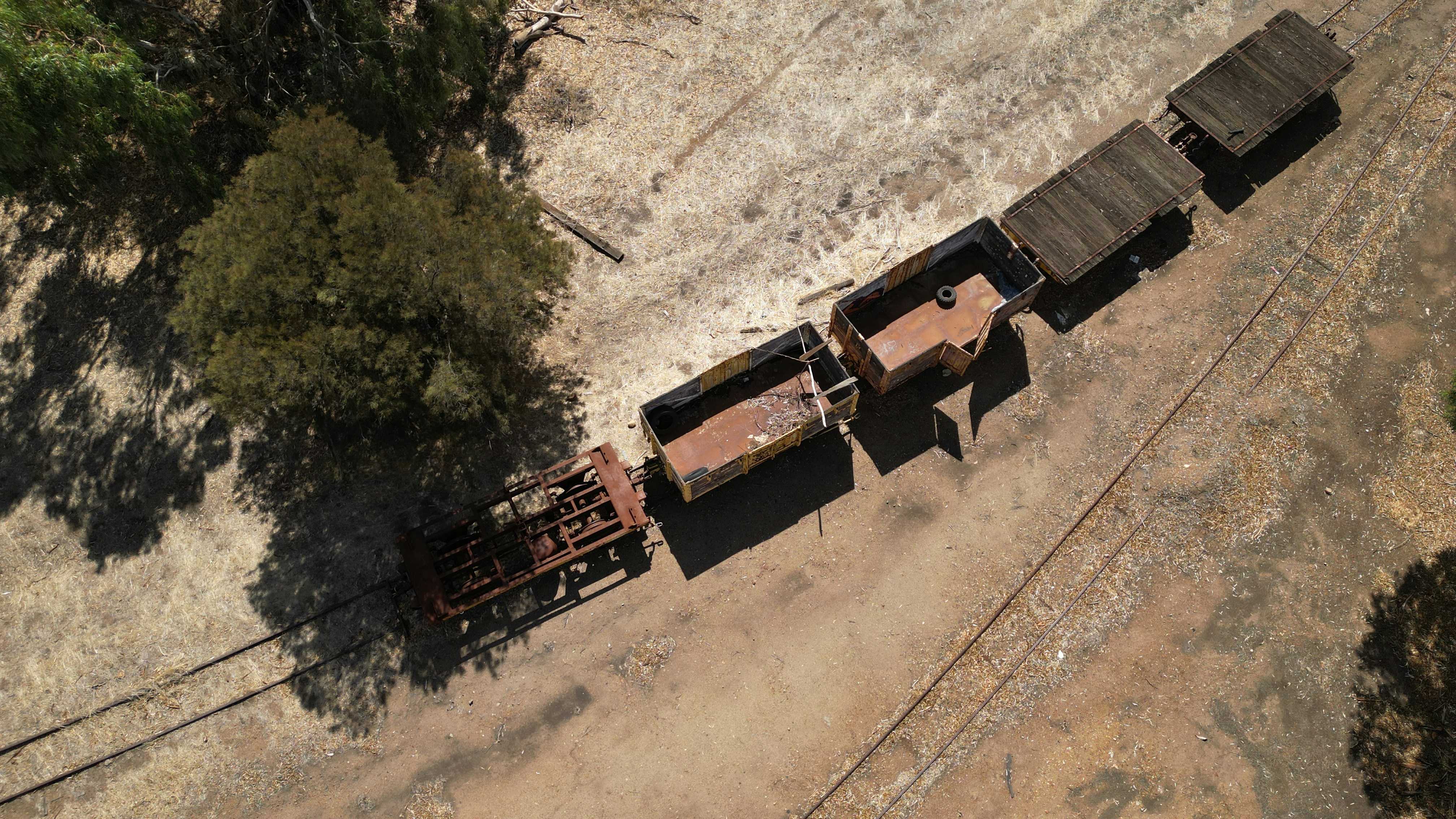 Dusty Rails, Weathered Carriages: A Silent Row of Freight History