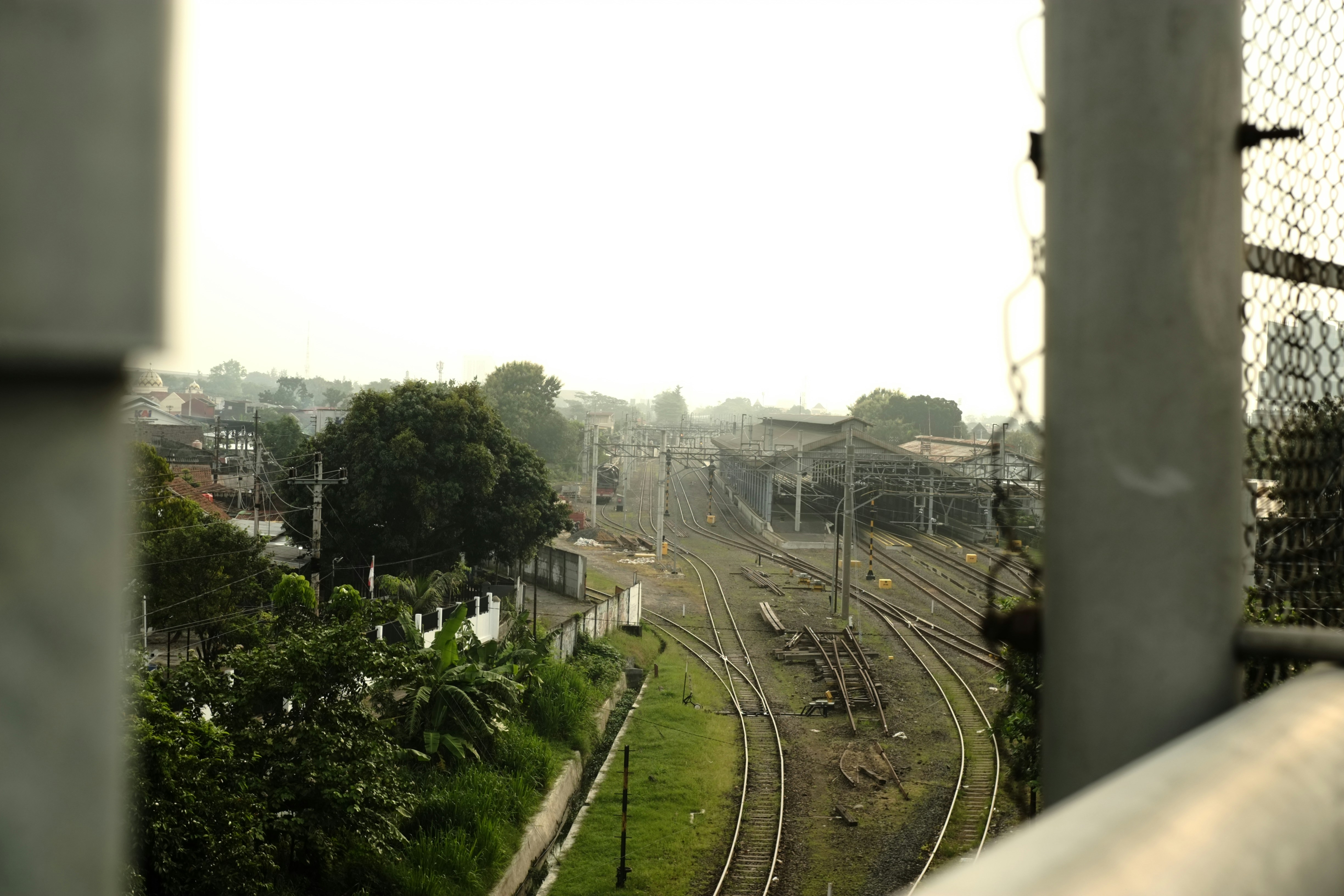 Railroad tracks lead away from the viewer. photo – Free Human Image on ...