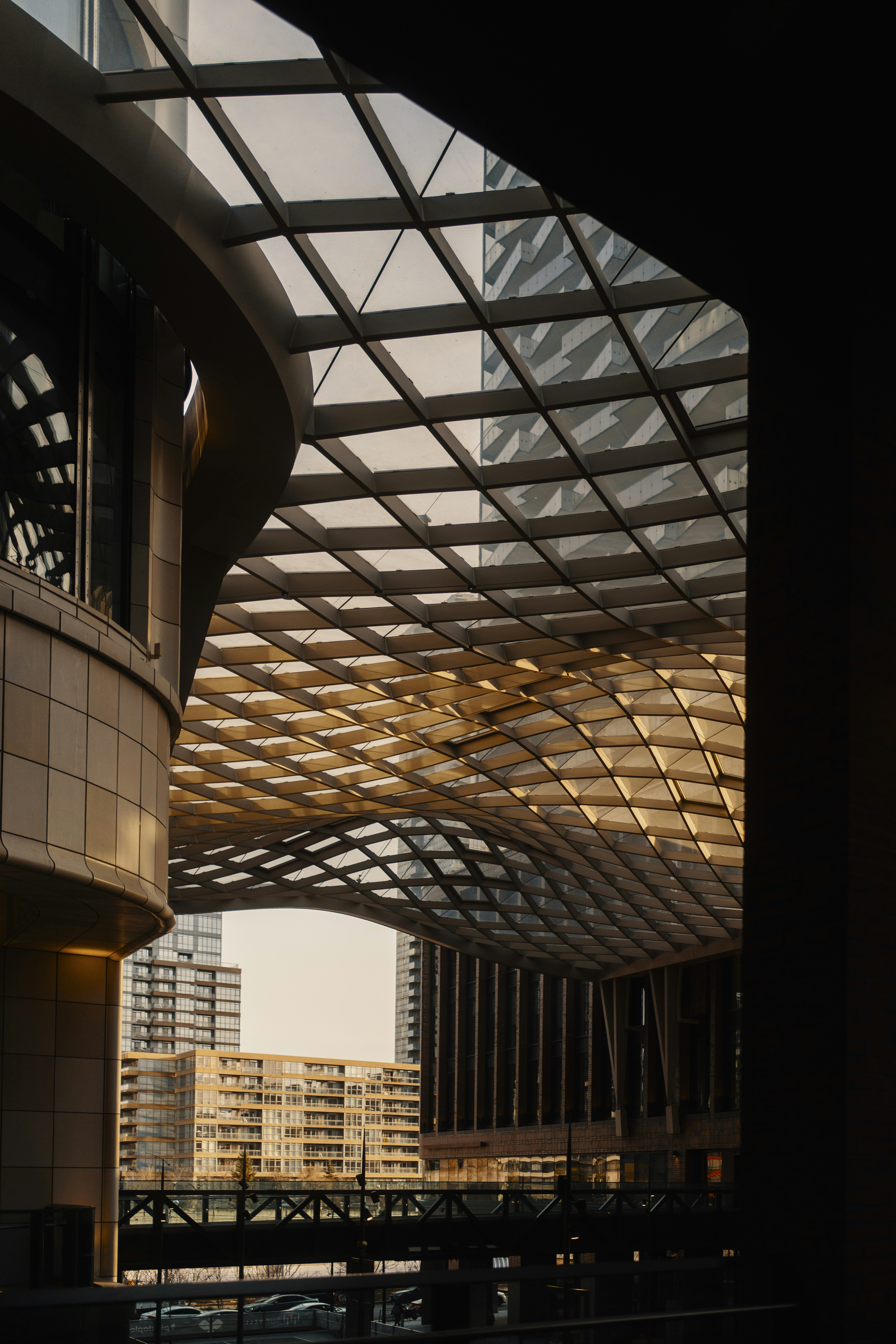 Modern buildings are viewed through an interesting architectural design ...