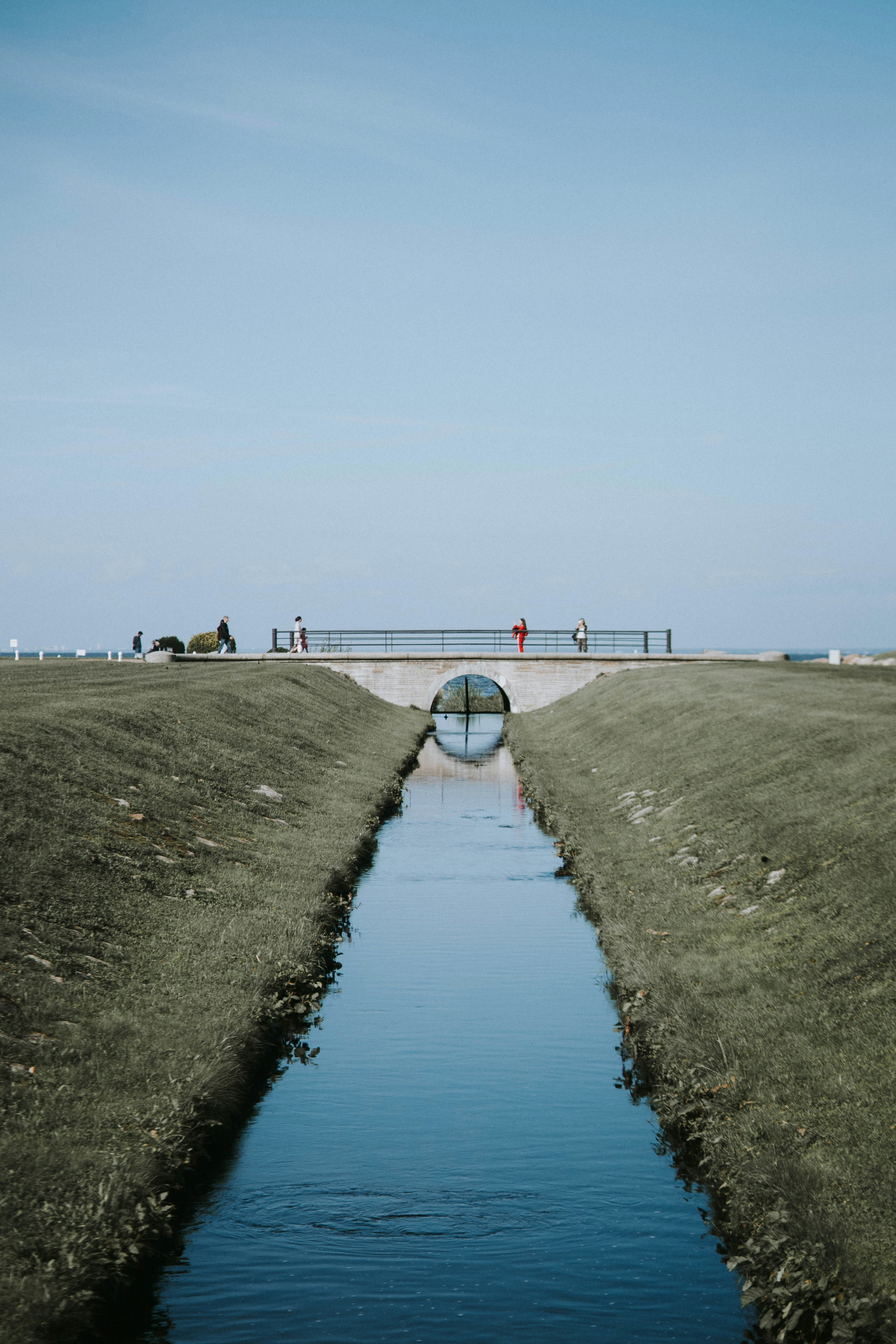 Canal Under the Bridge: A Quiet Horizon Amid the Dike