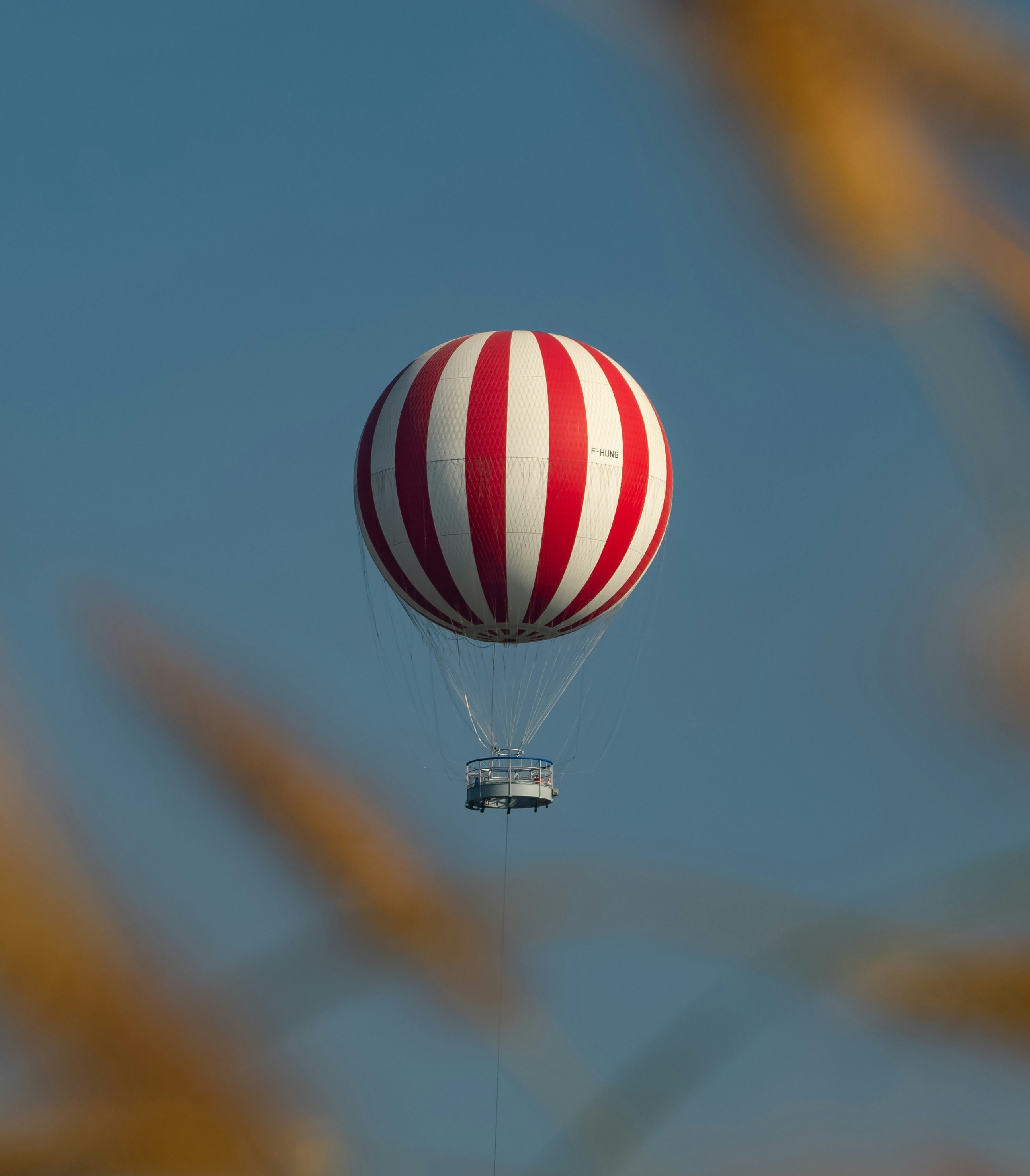 Ascending Dreams: The Striped Balloon Journey