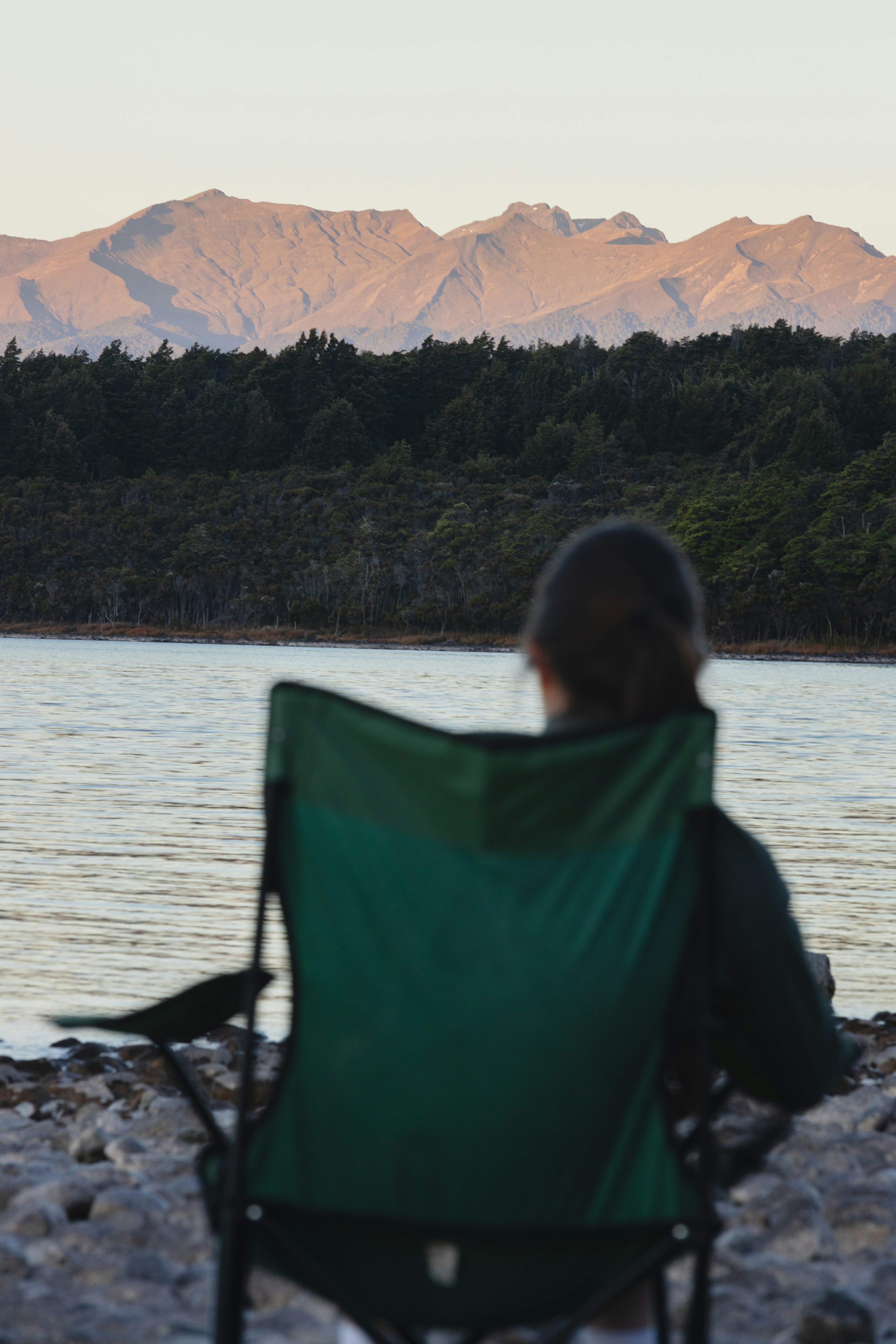 Person relaxes in nature, gazing at mountains. photo – Free Woman Image ...