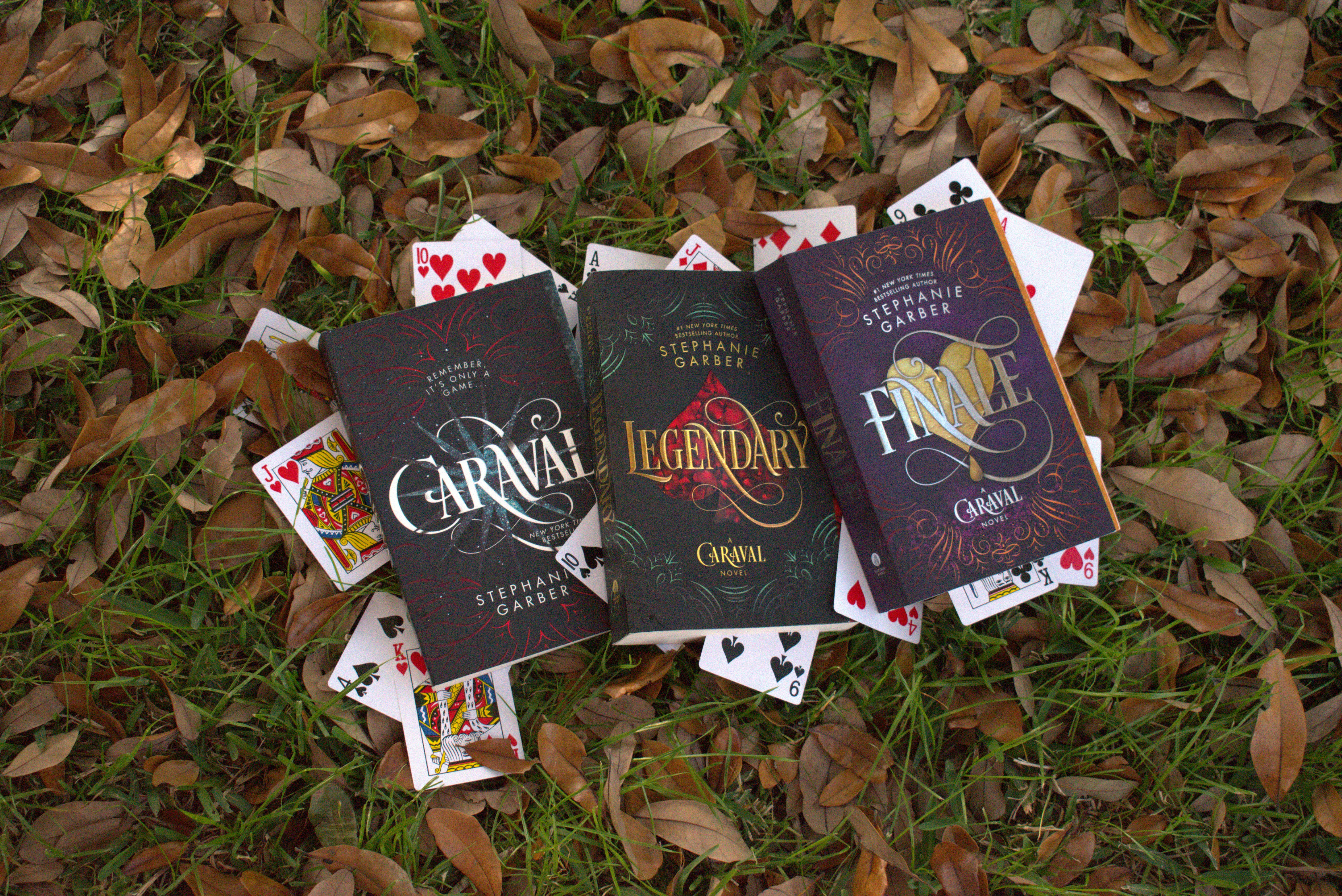 Three books surrounded by playing cards and leaves. photo – Free Book ...