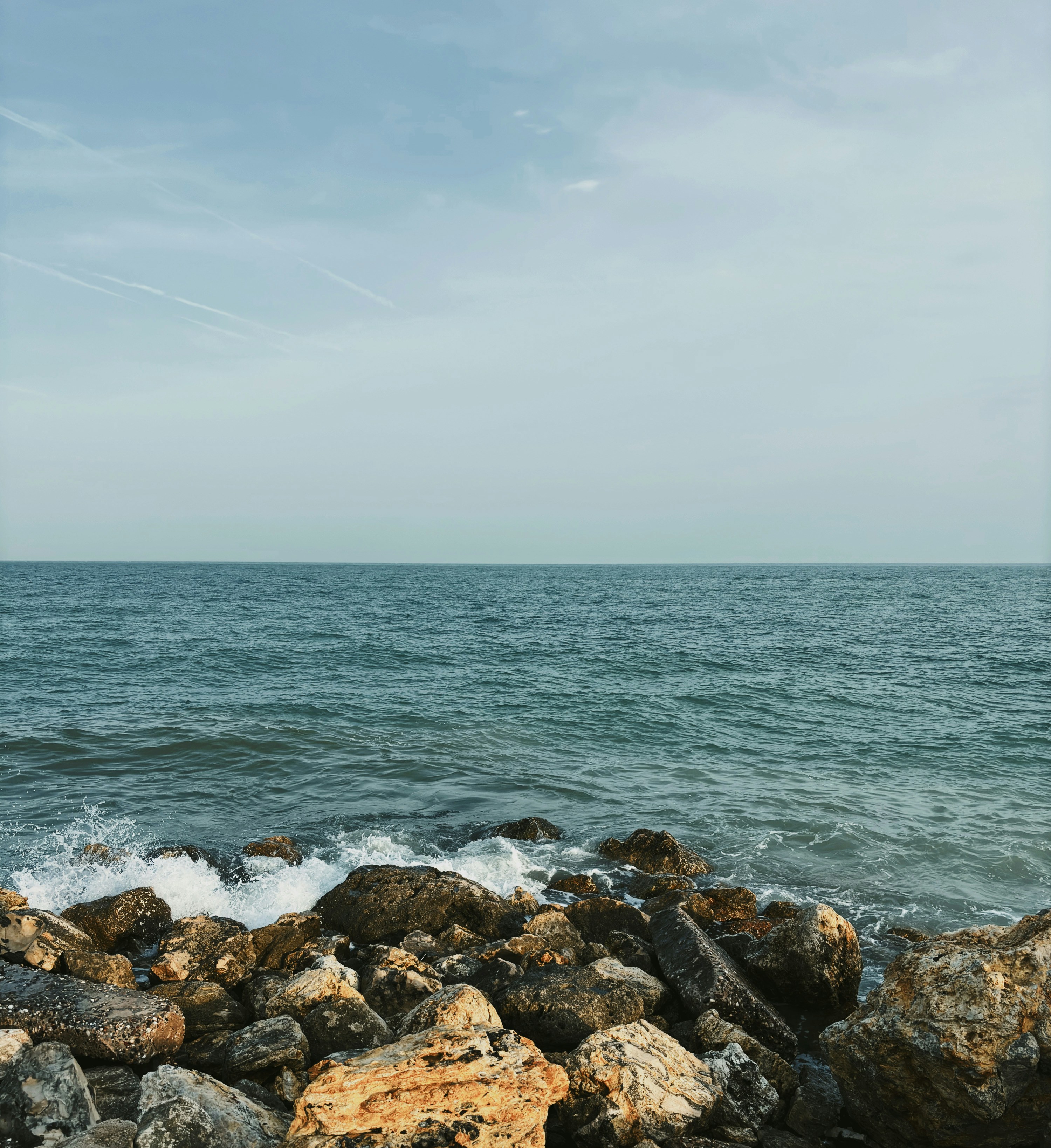 Scenic rocky seaside with calm ocean waves