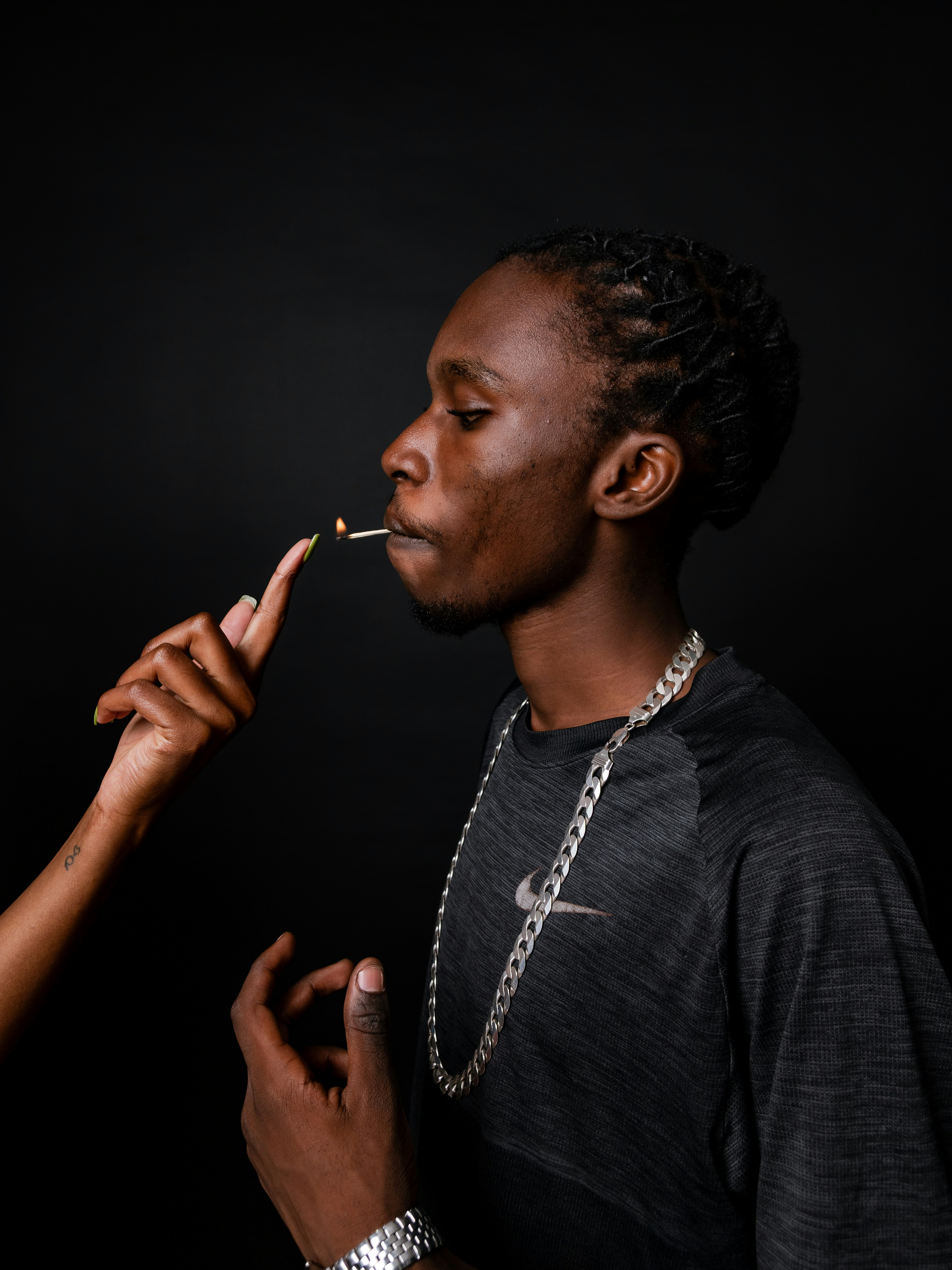 Matchlight Moment: A Profile Portrait in Shadow and Flame