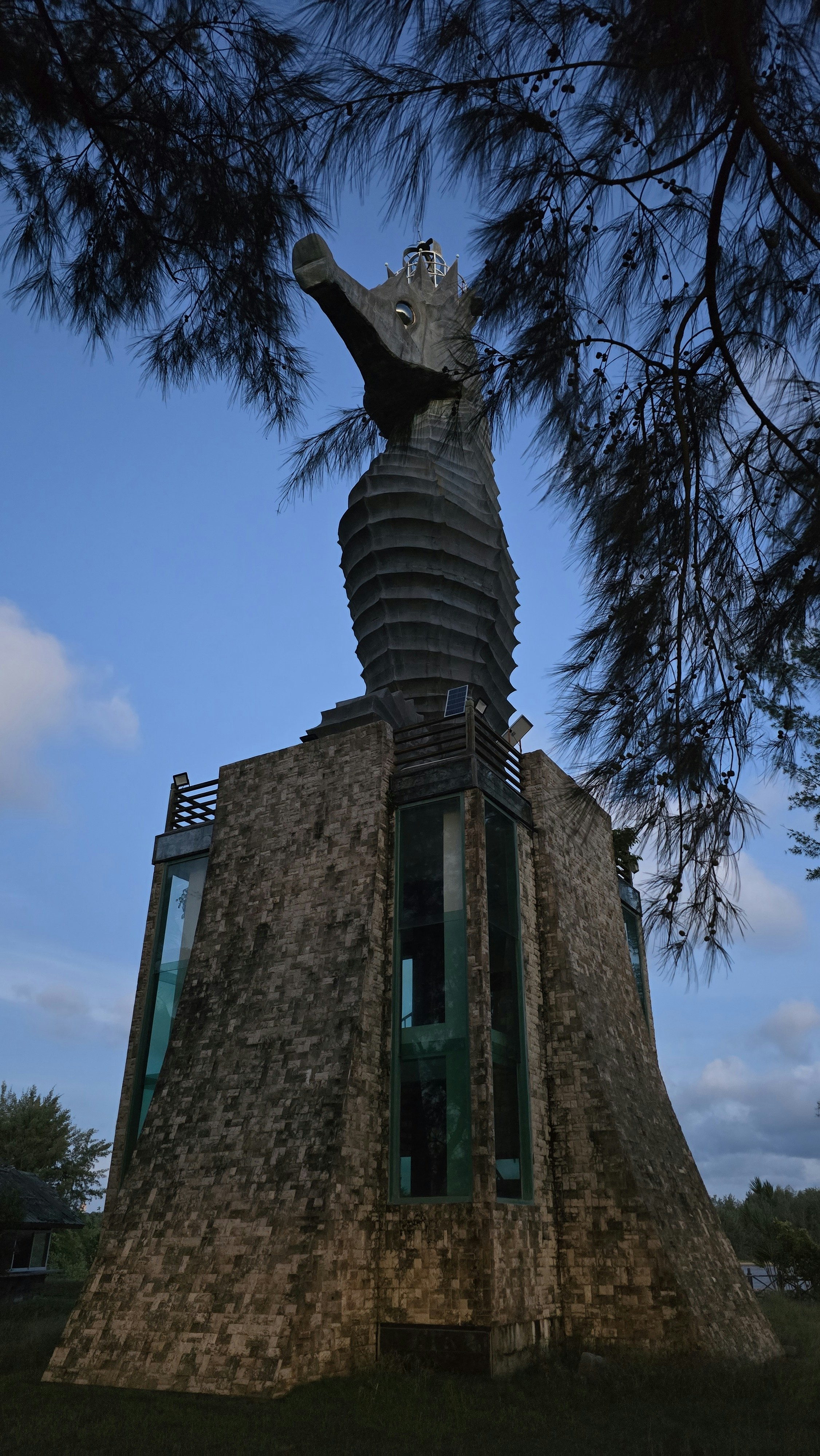 Dragon-Spire Rising: Brick Tower Framed by Pine Shadows