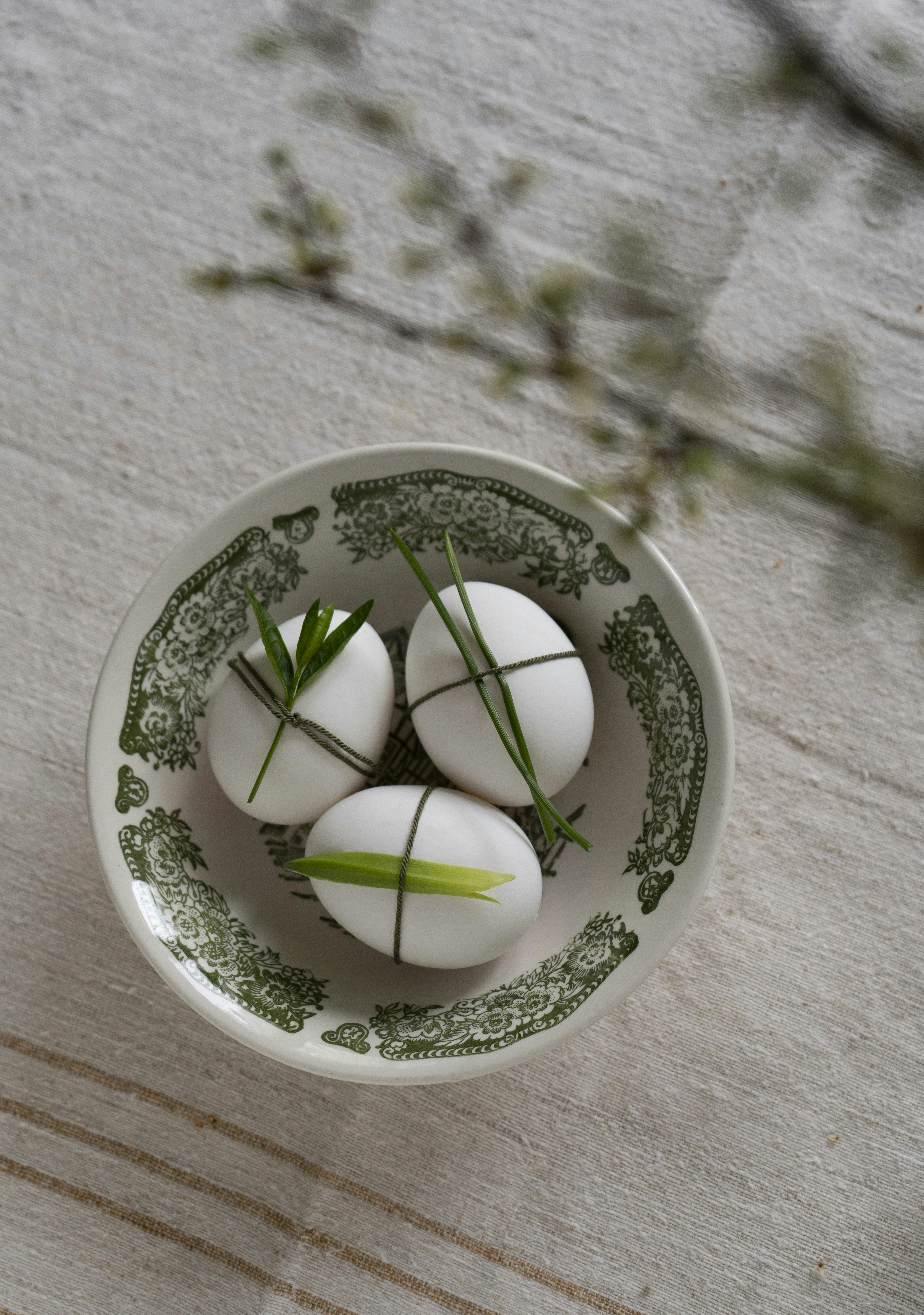 Tied Trio: Eggs in a Green-Trimmed Porcelain Bowl