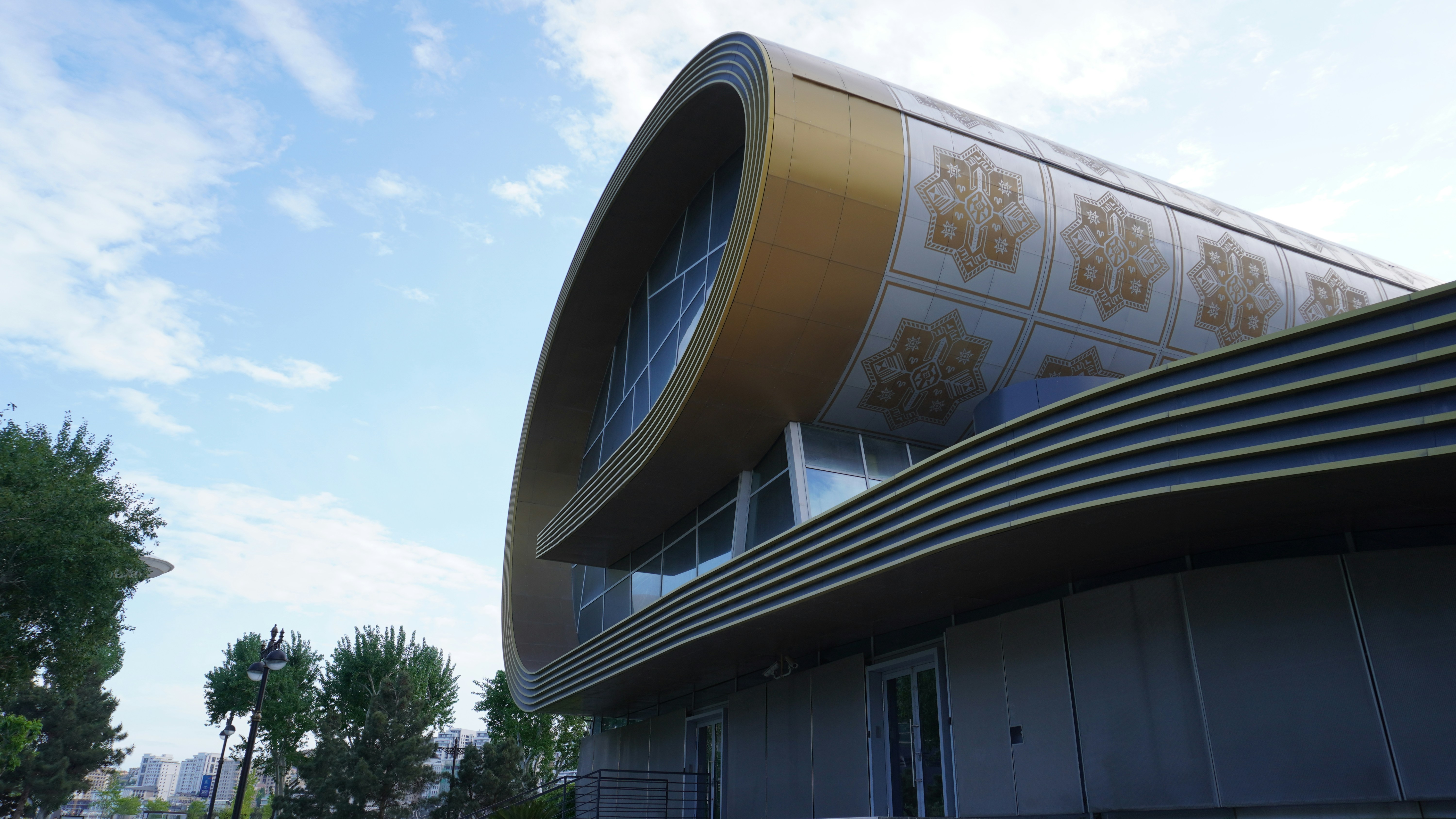 Here's a caption for the image: modern architecture with an oval window ...