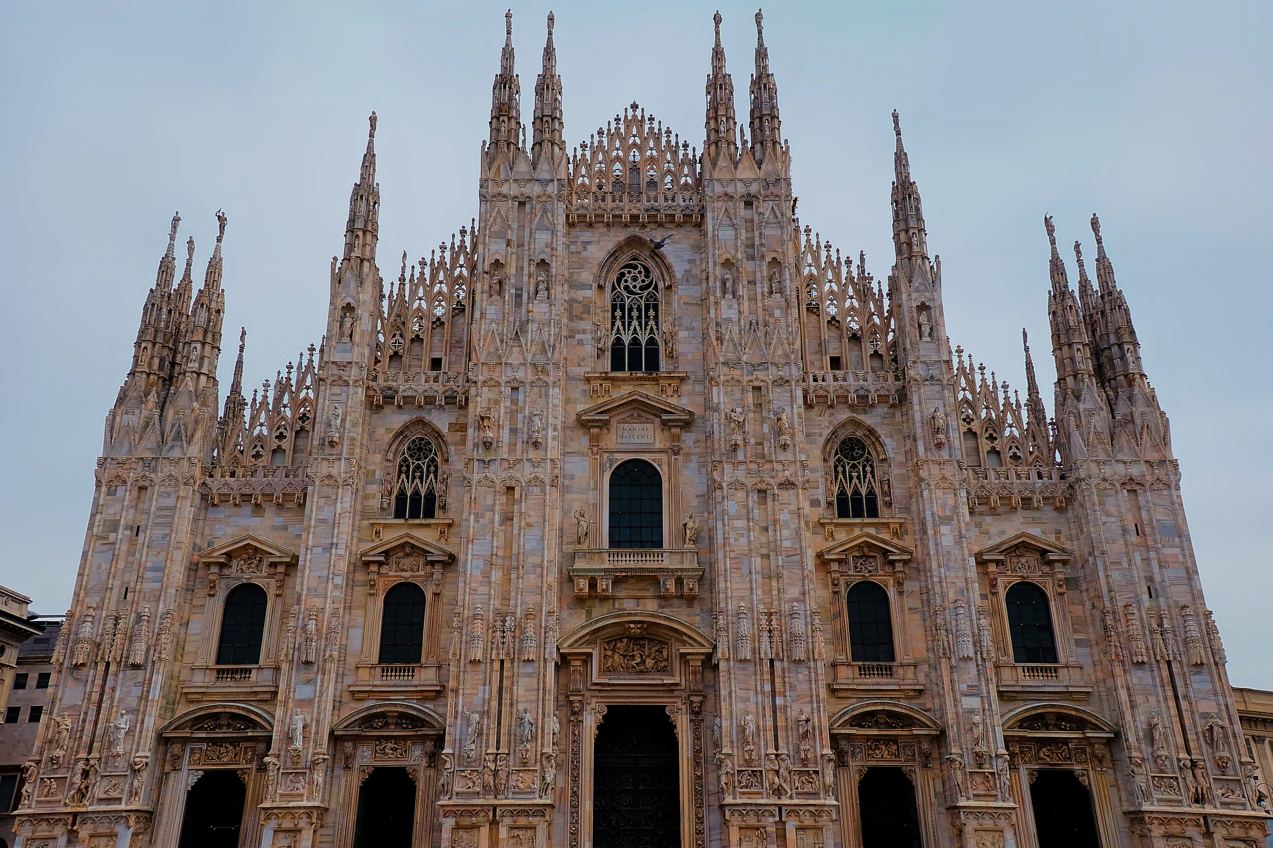The milan cathedral showcases exquisite gothic architecture. photo ...