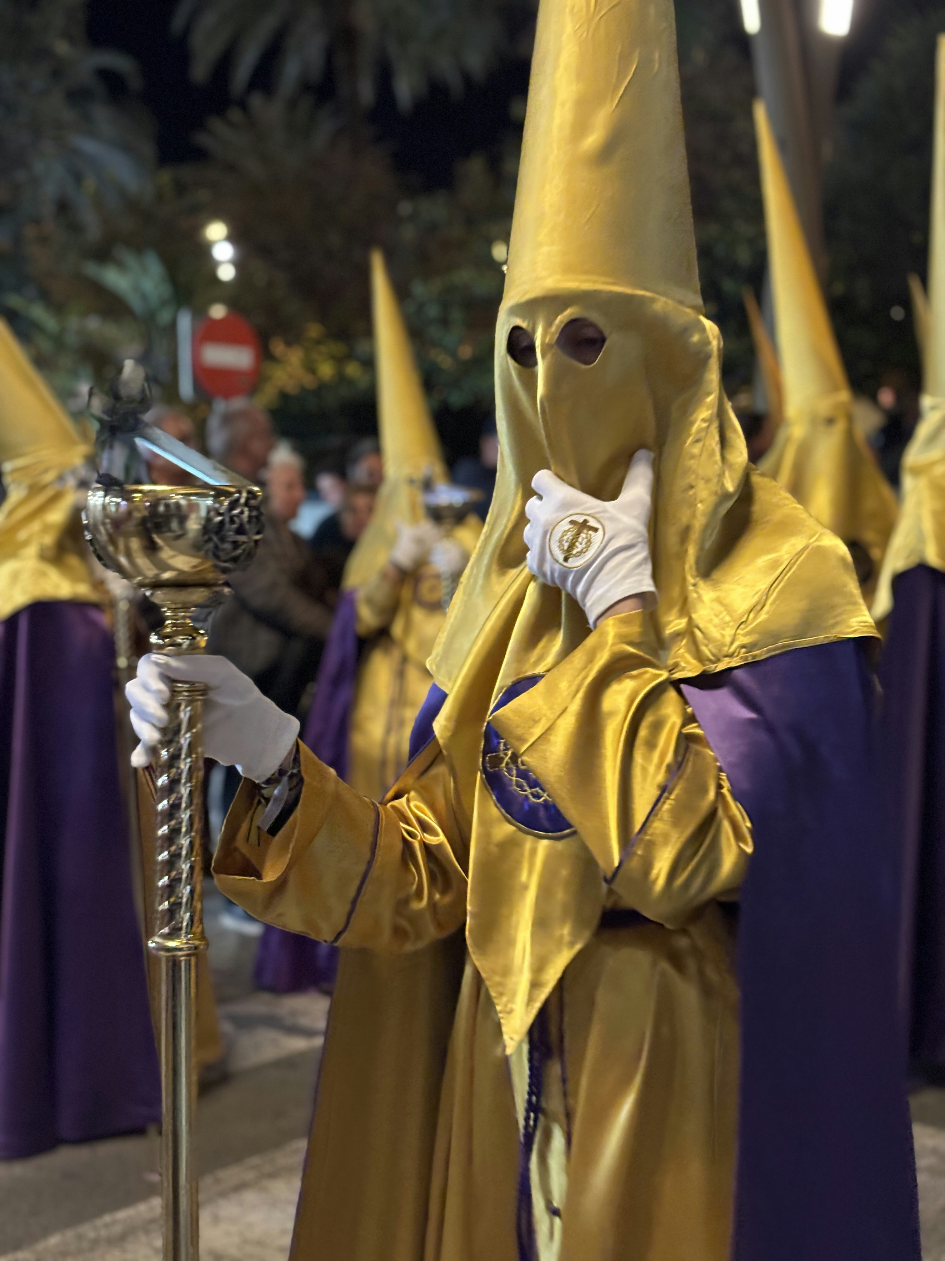 People in hooded costumes parade during a festival. photo – Free Spain ...