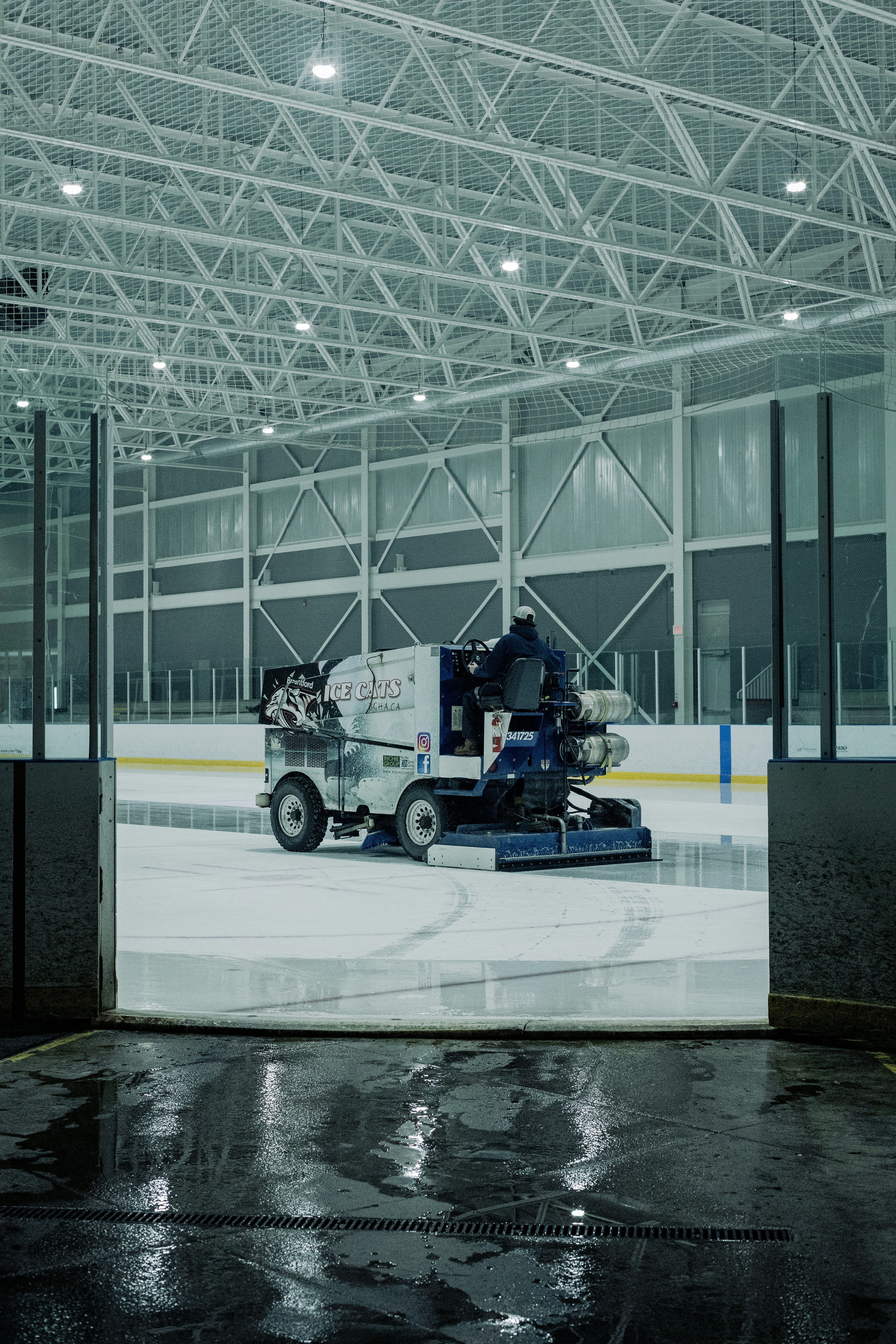 Hushed Glide Beneath the Ice-Rink Lattice: A Zamboni at Work