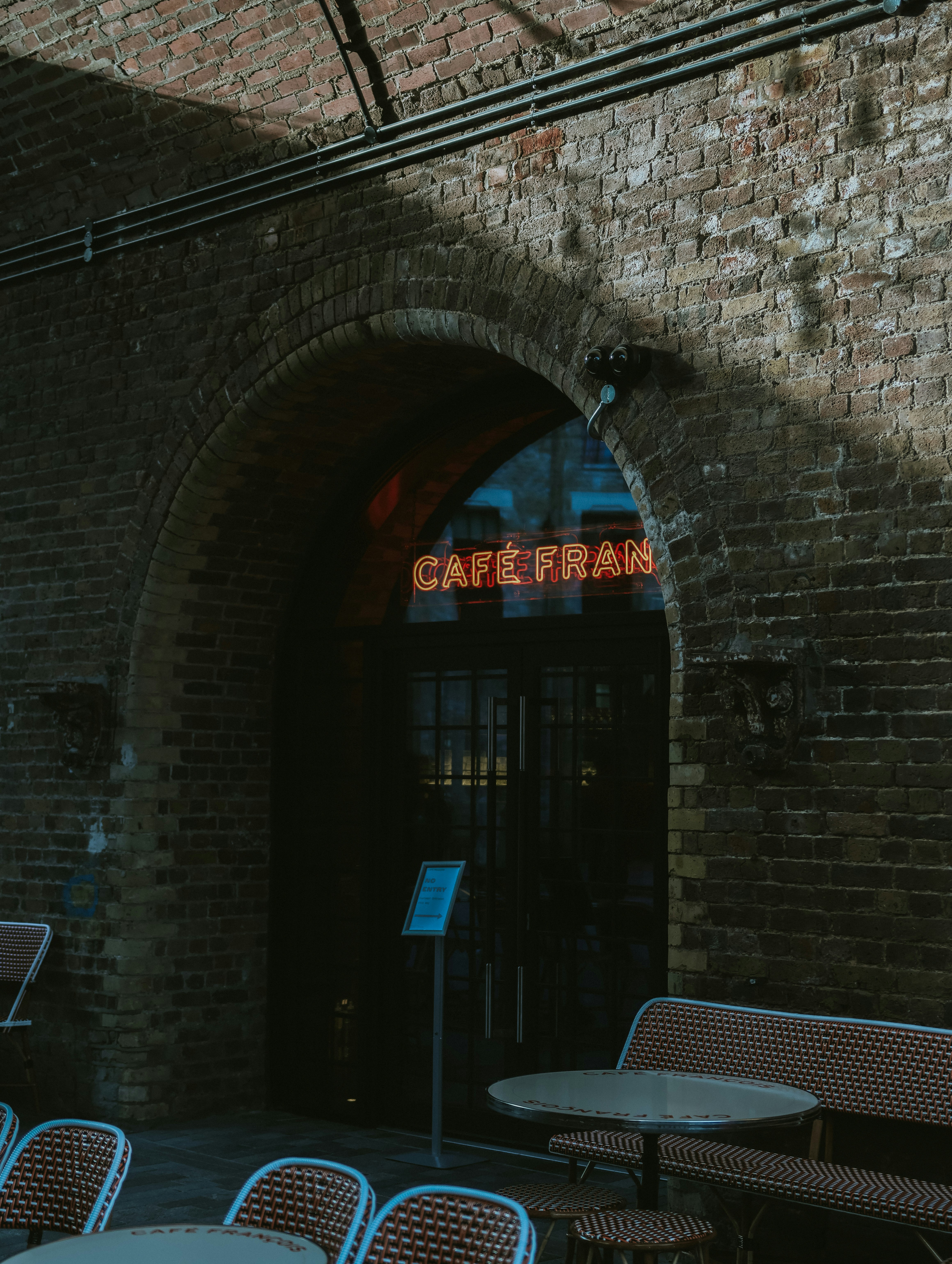 A cafe fran entrance is lit with neon lights. photo – Free Building ...