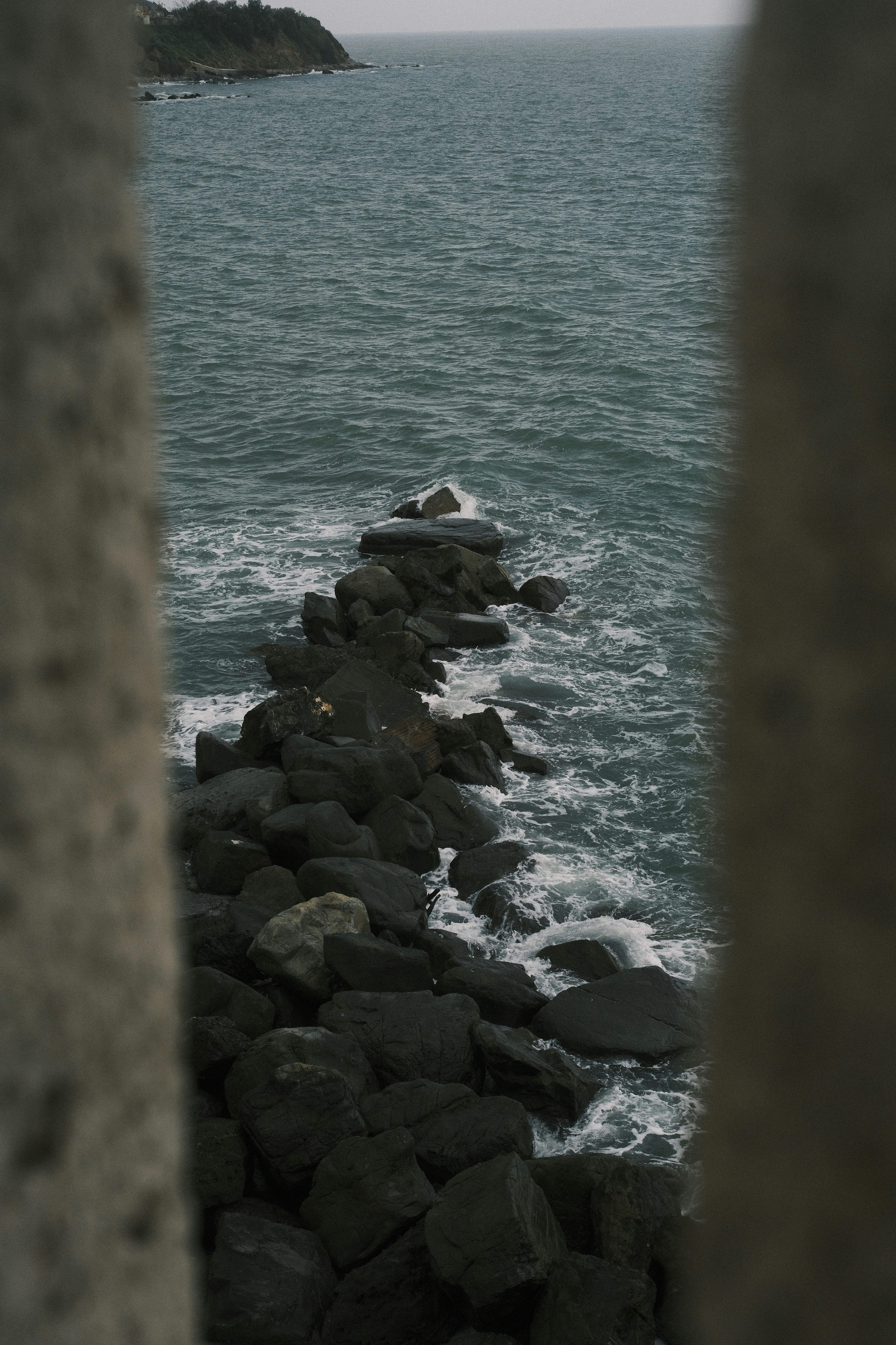 Rocks form a path into the vast, open sea. photo – Free Sea Image on ...
