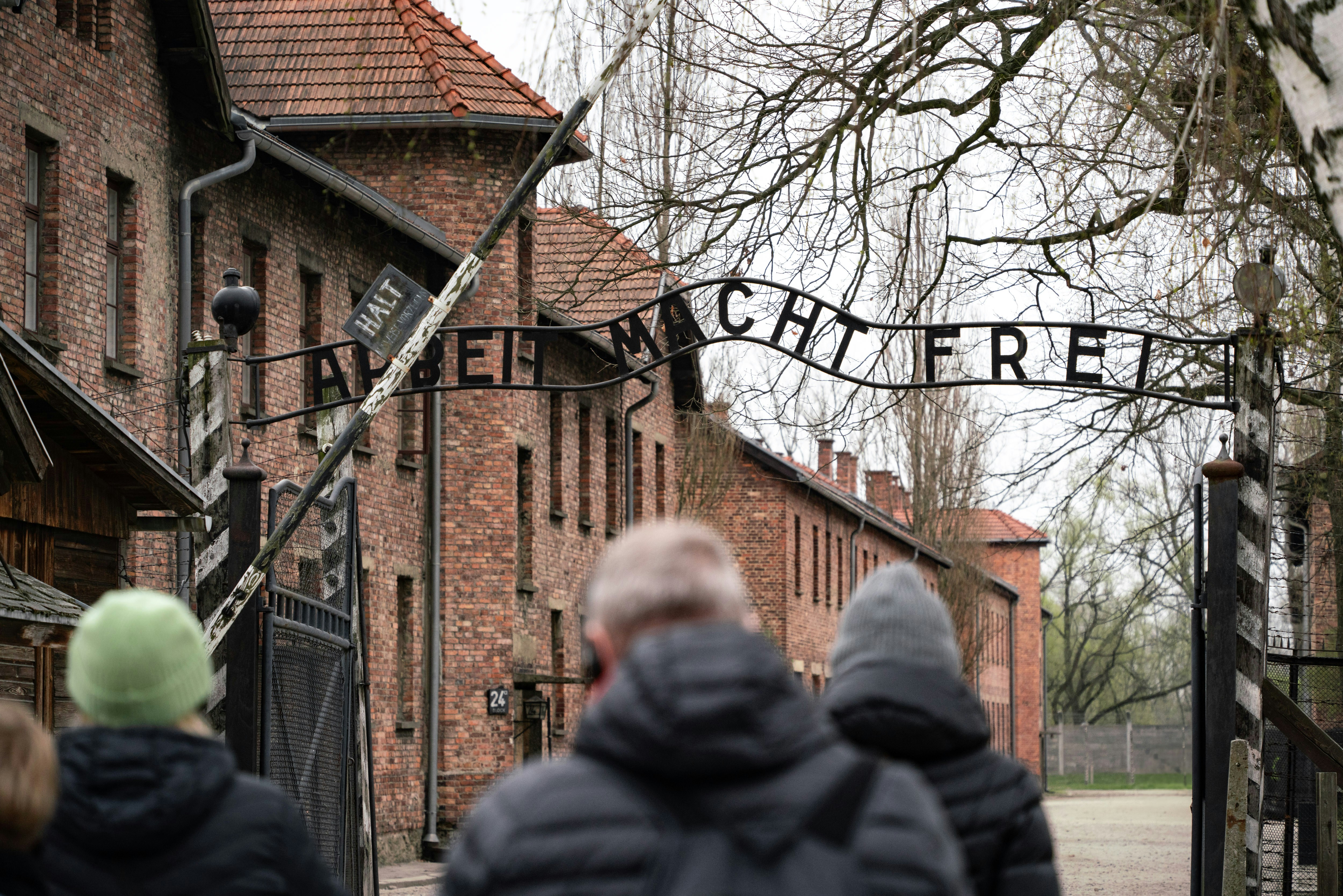 Gate of Remembrance: Visitors Entering a stark brick complex