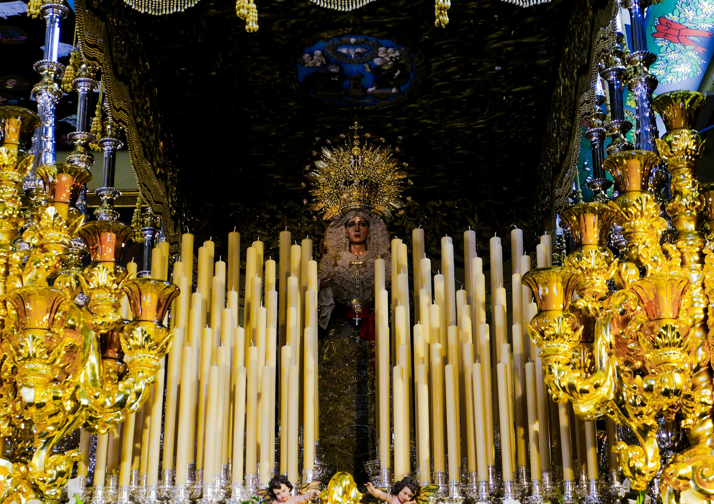 A religious procession features candles and a statue. photo – Free ...