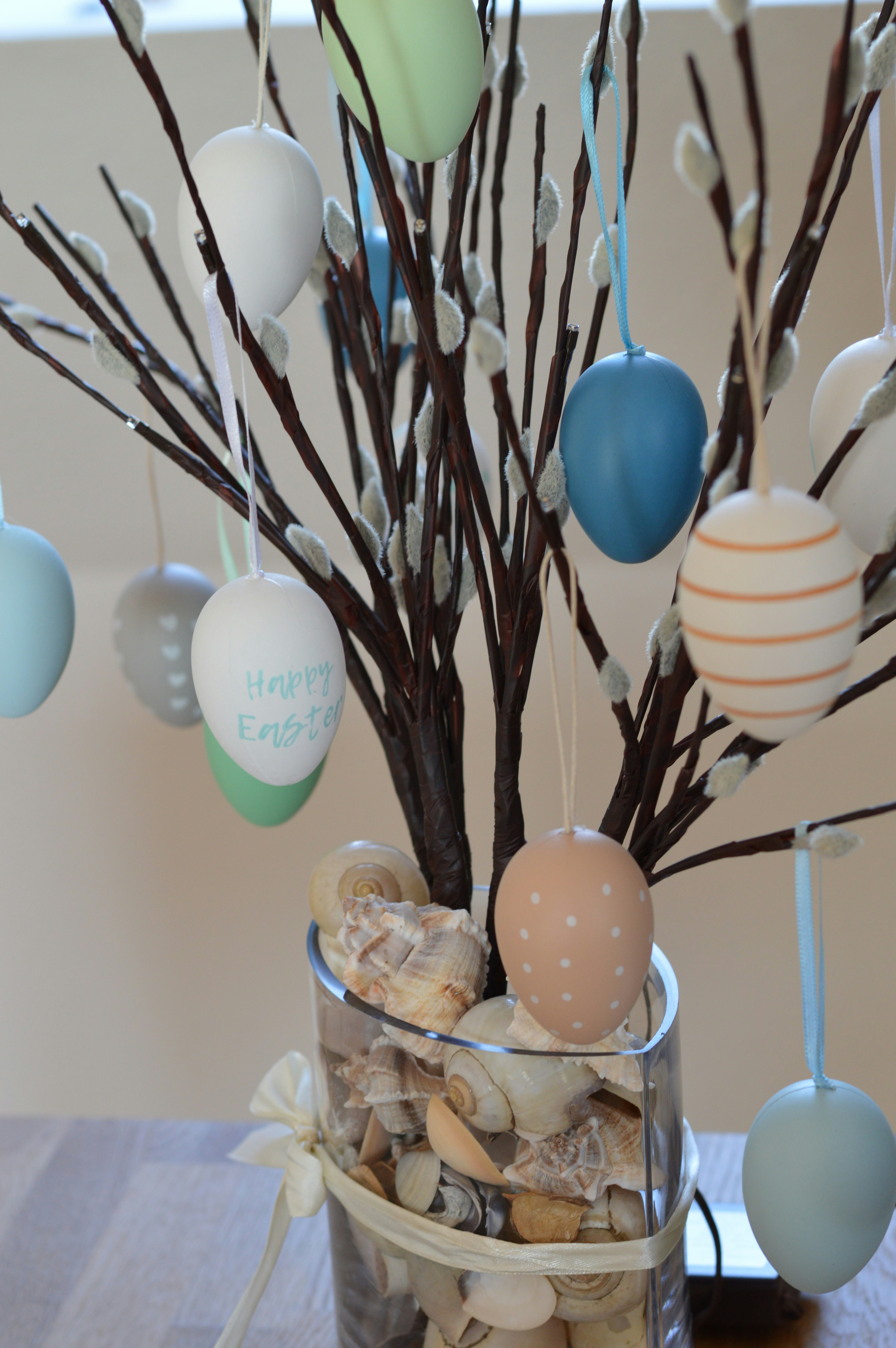 Pastel Easter Chalice: Branches with Hanging Eggs in a Glass Vase