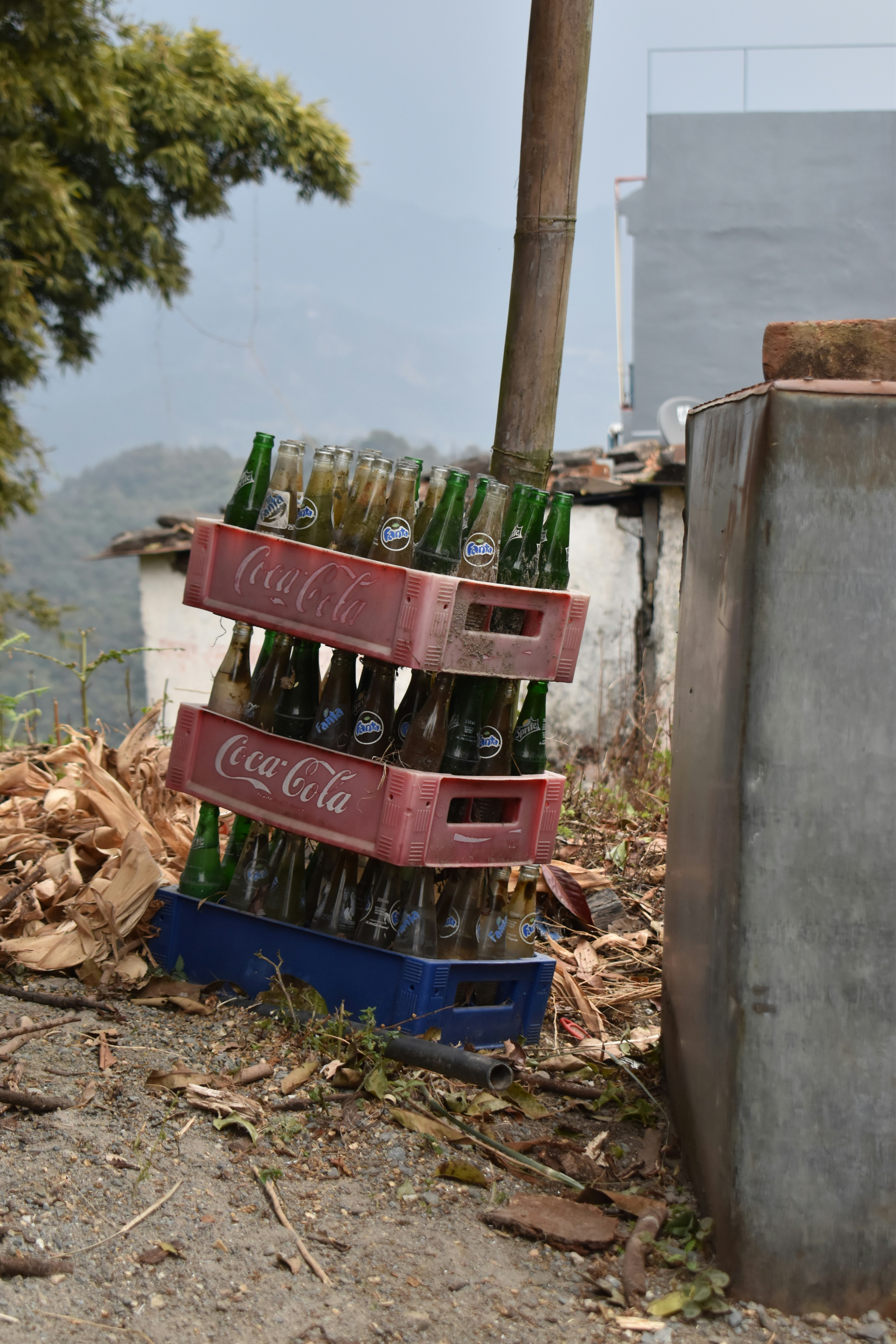 Crates of coca-cola bottles are stacked precariously. photo – Free ...