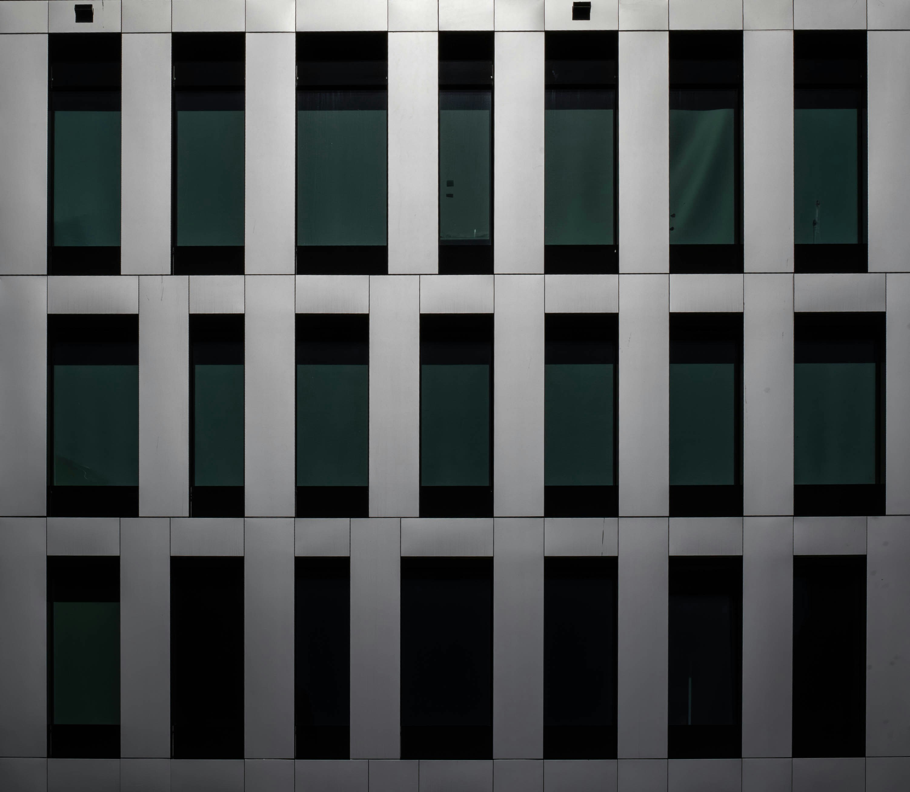 Building facade with rectangular windows and panels. photo – Free Urban ...