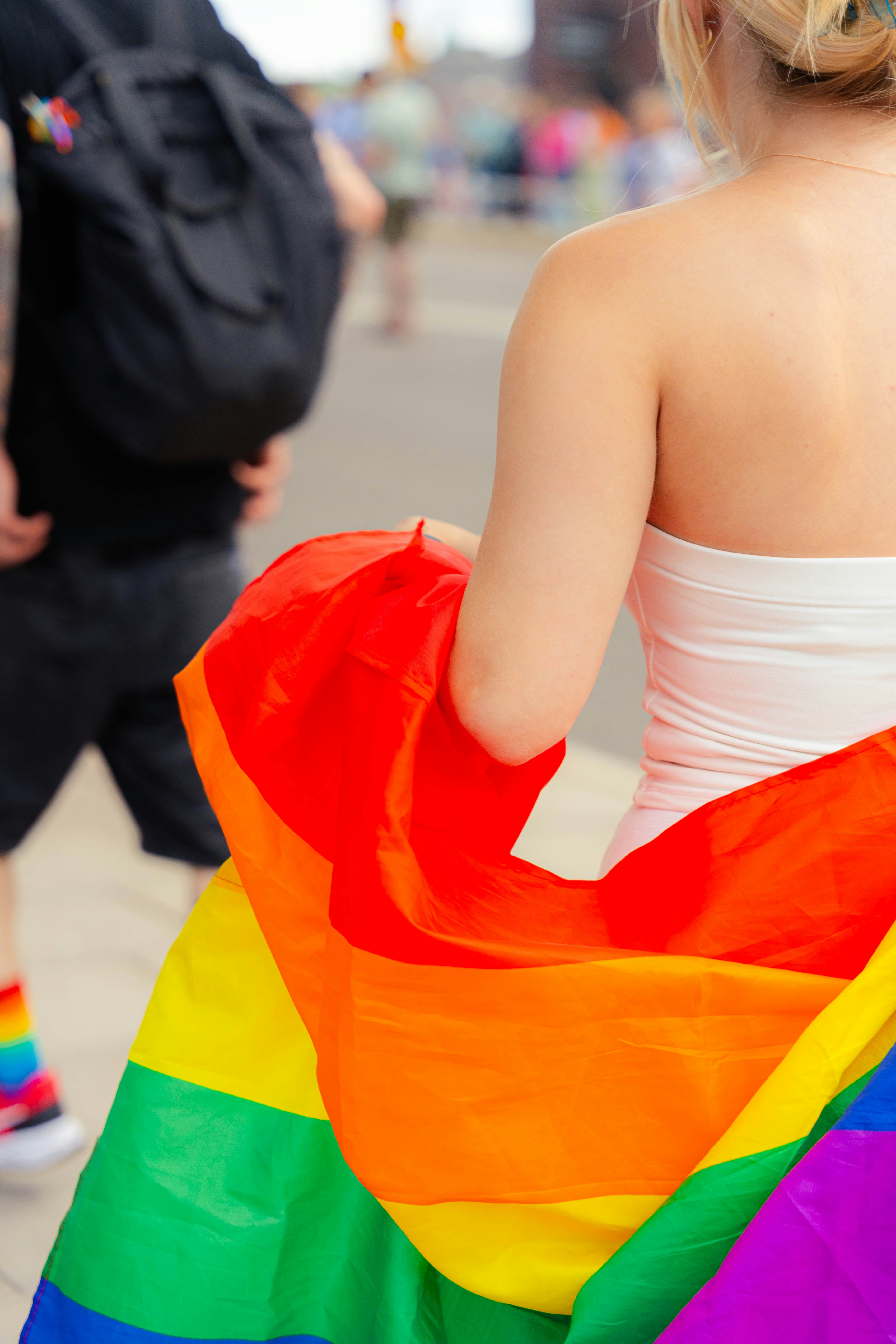 Wrapped in Color: A Drape of Pride Over One Shoulder