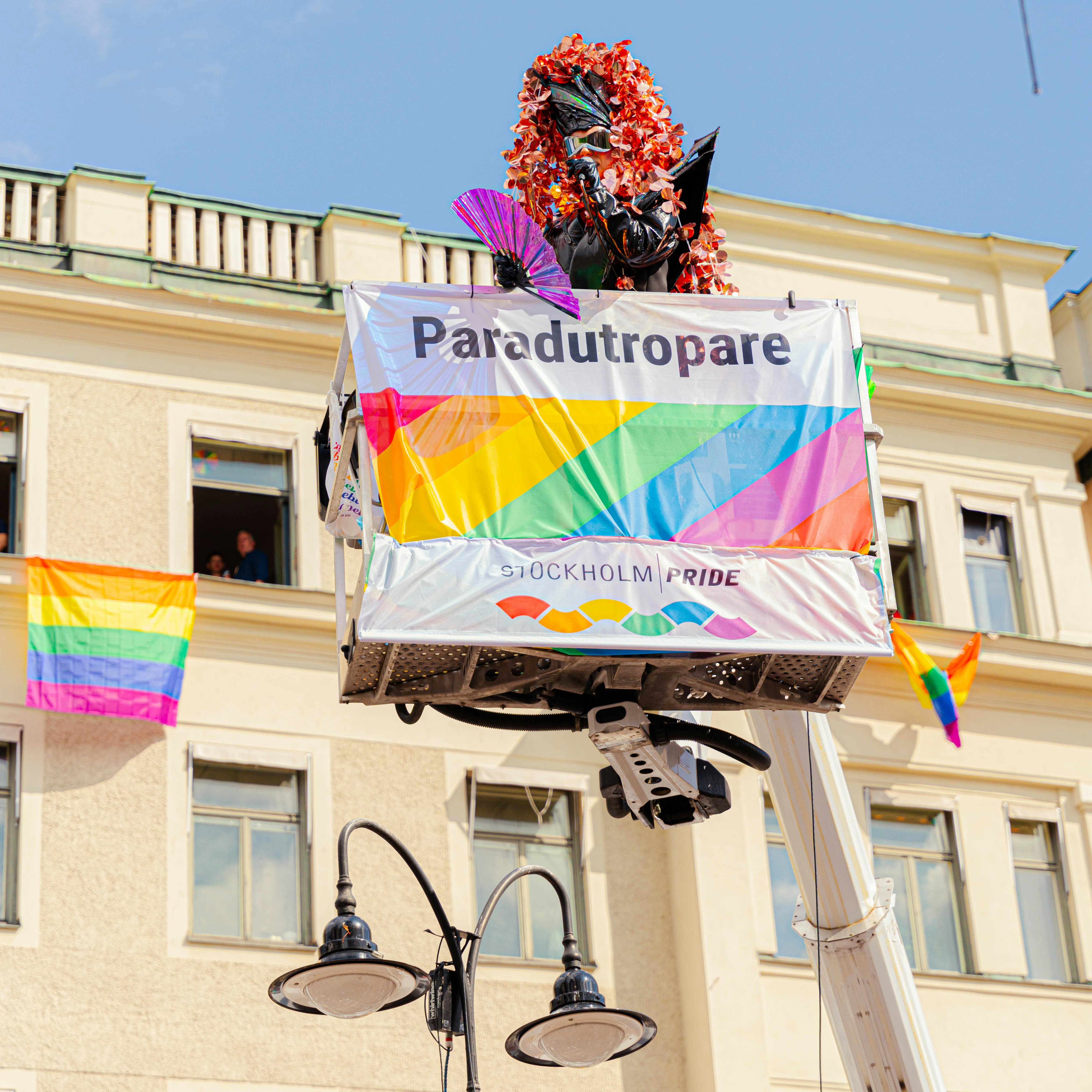 A colorful pride parade banner is raised high. photo – Free Love Image ...