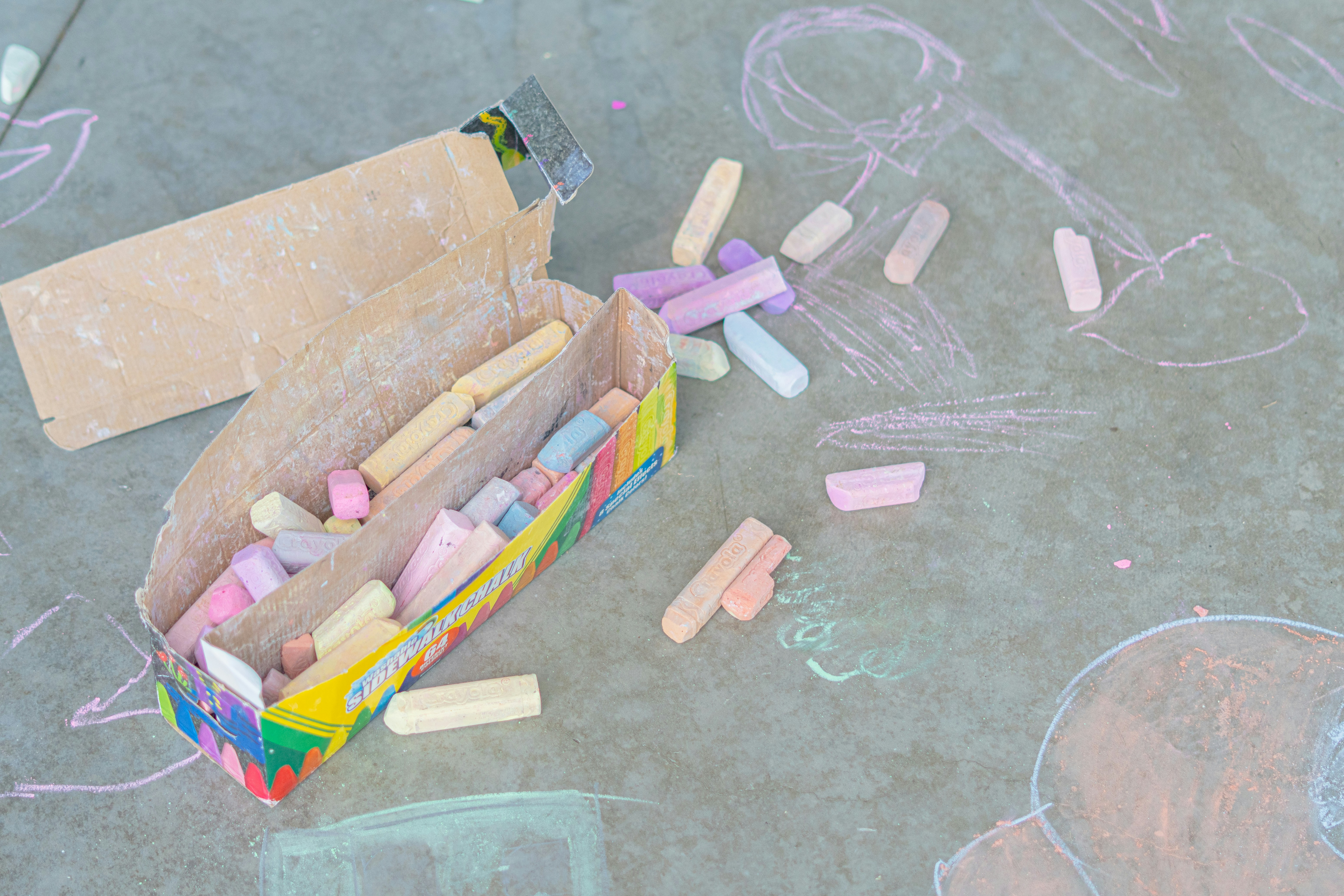 Chalkbox and colorful chalk on a surface. photo – Free Art Image on ...