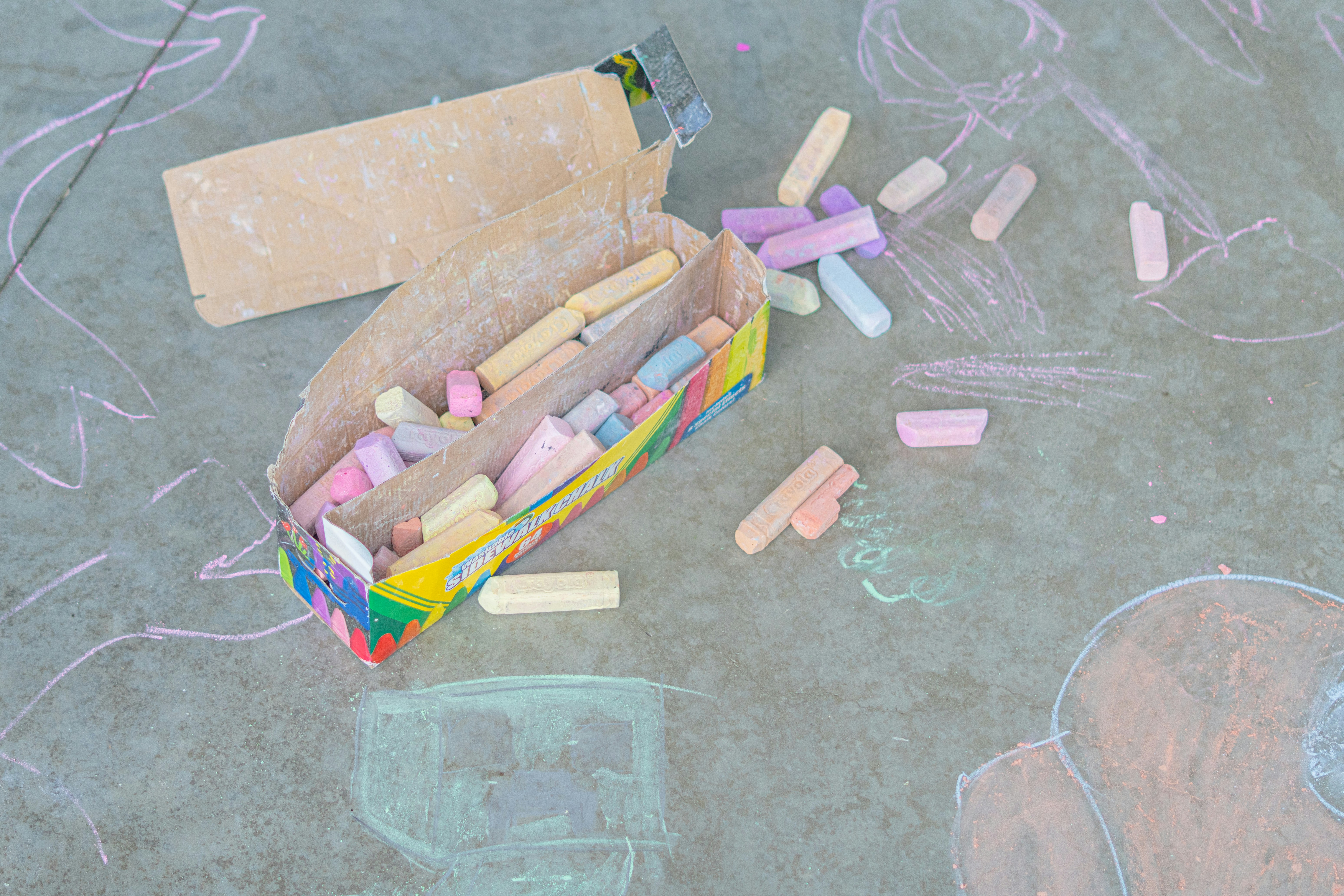 Chalkbox opened, chalk pieces spilled on pavement. photo – Free Art ...