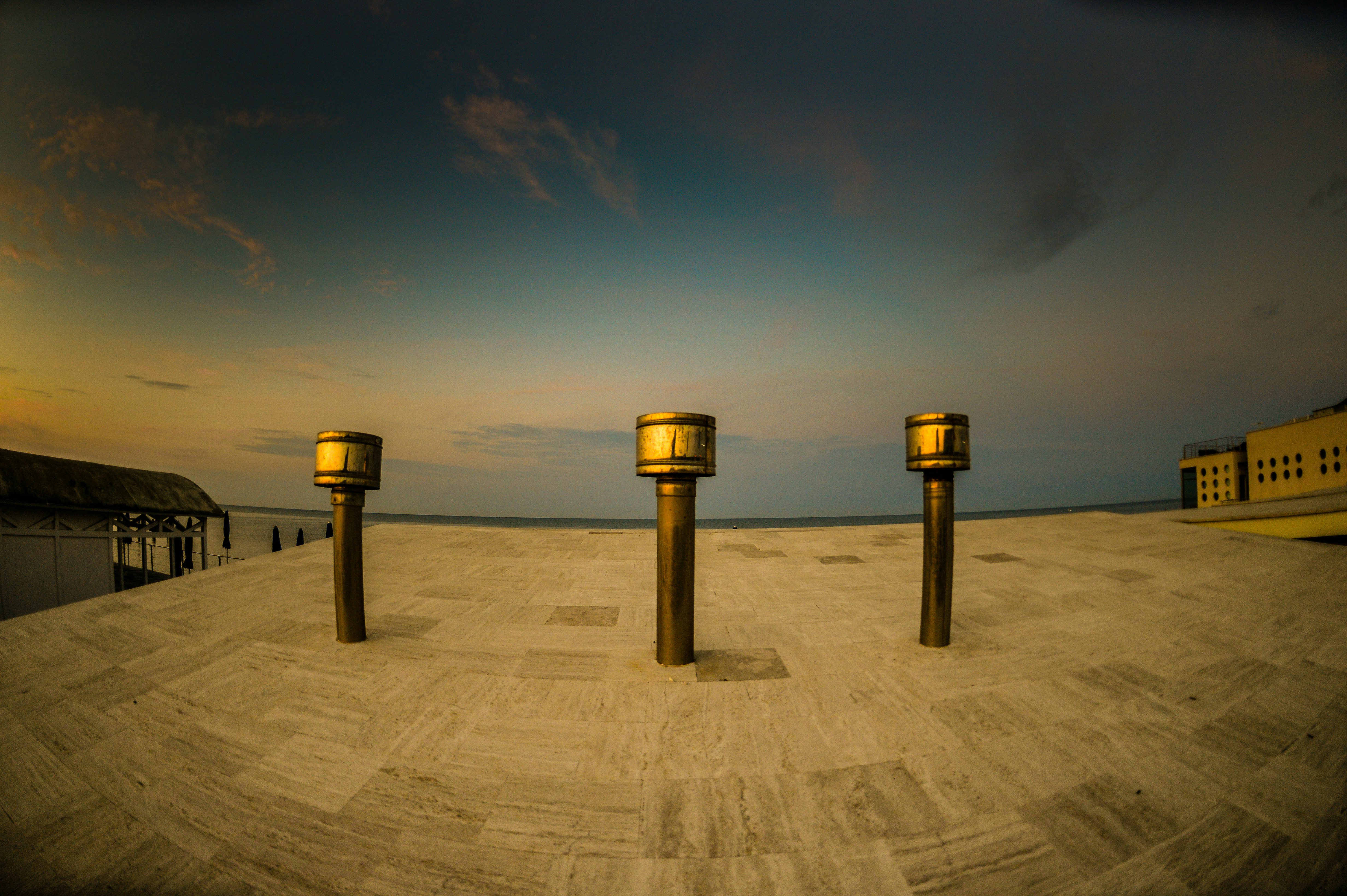 Three brass chimneys on a concrete roof. photo – Free Wallpaper 4k ...