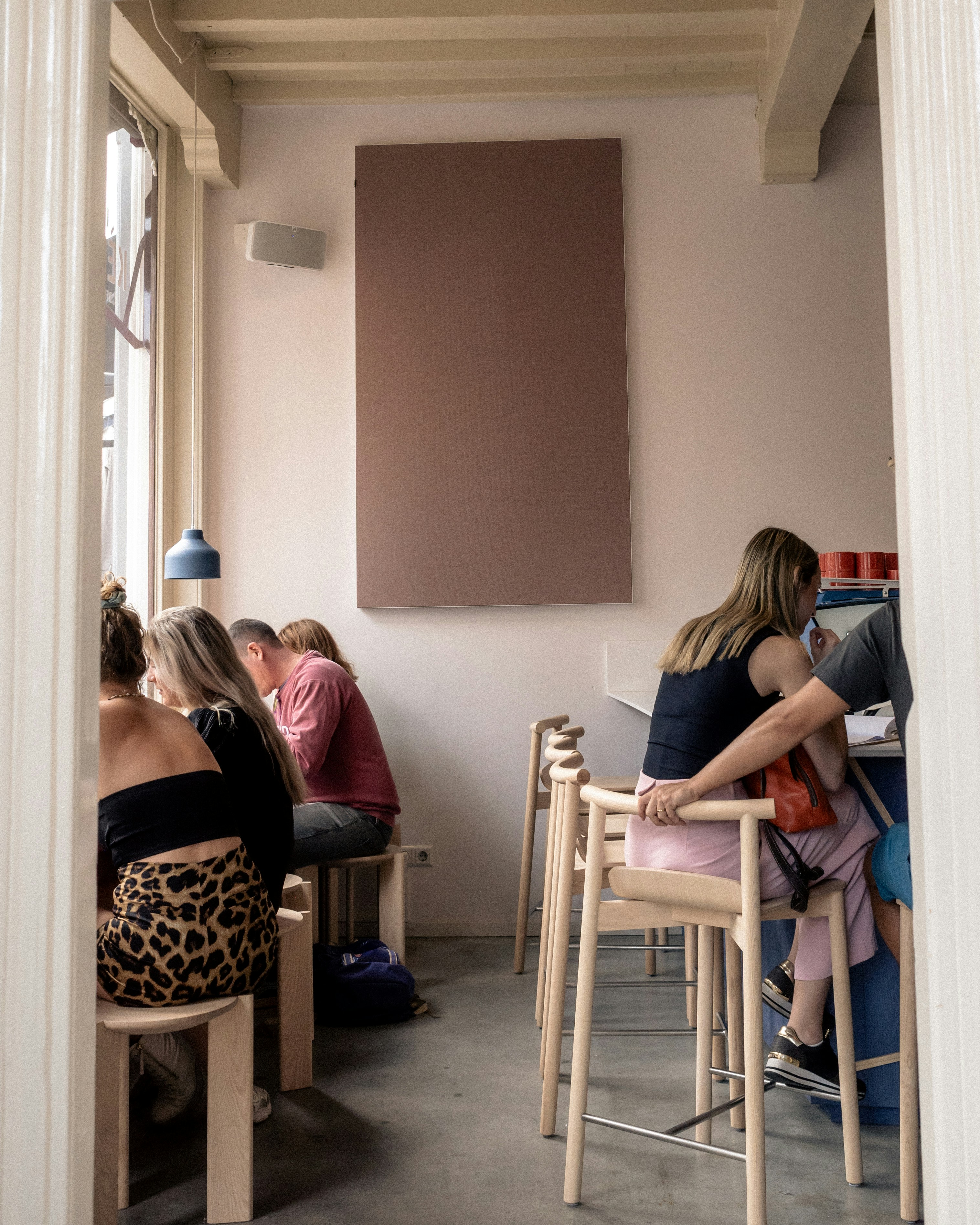 The Tall Panel and Quiet Conversations in a Sunlit Café